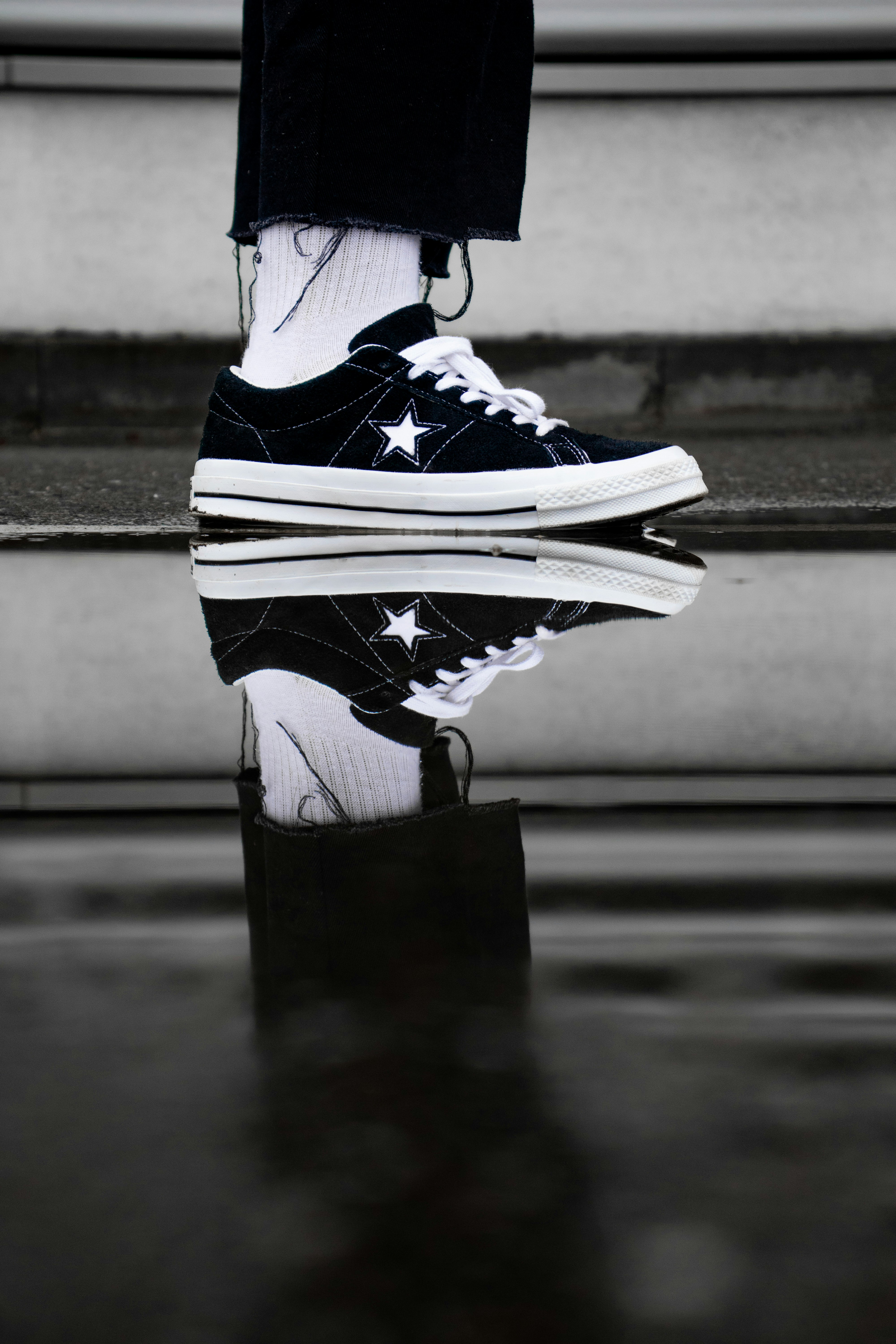Star Mark on a Wet Stage: A Sneaker and Its Mirror Image