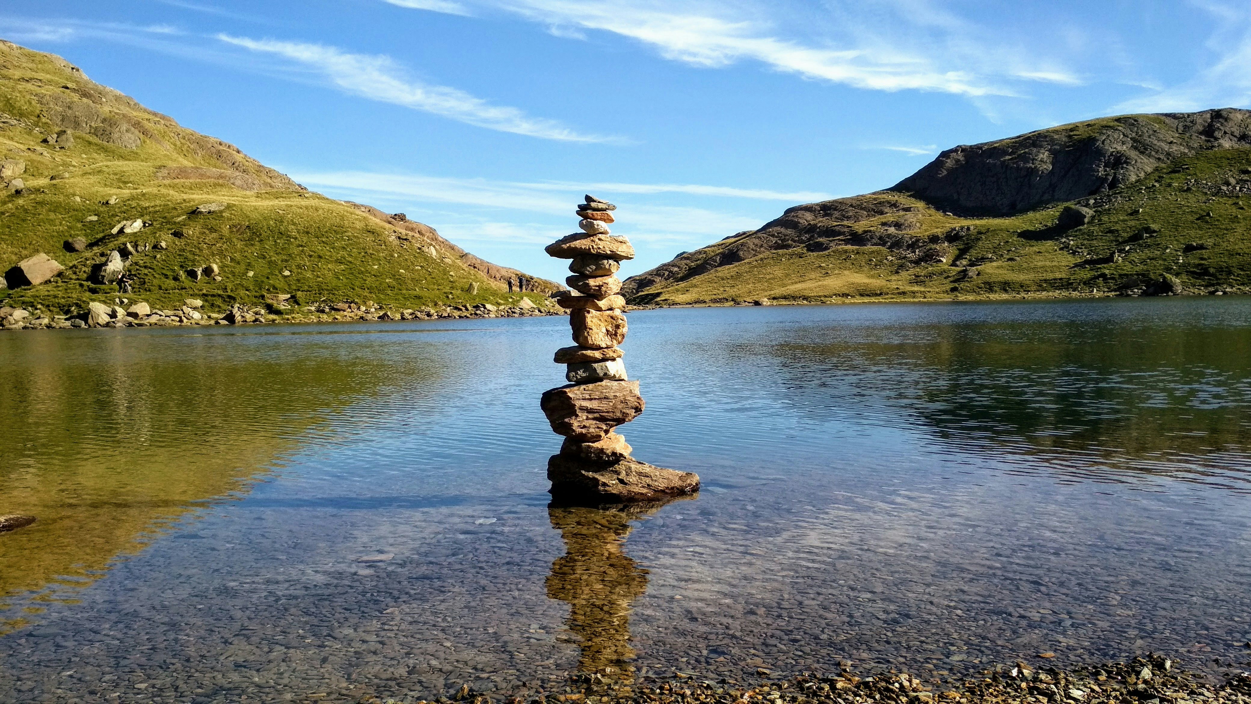 Gray stone on body of water during daytime photo – Free Snowdon Image ...