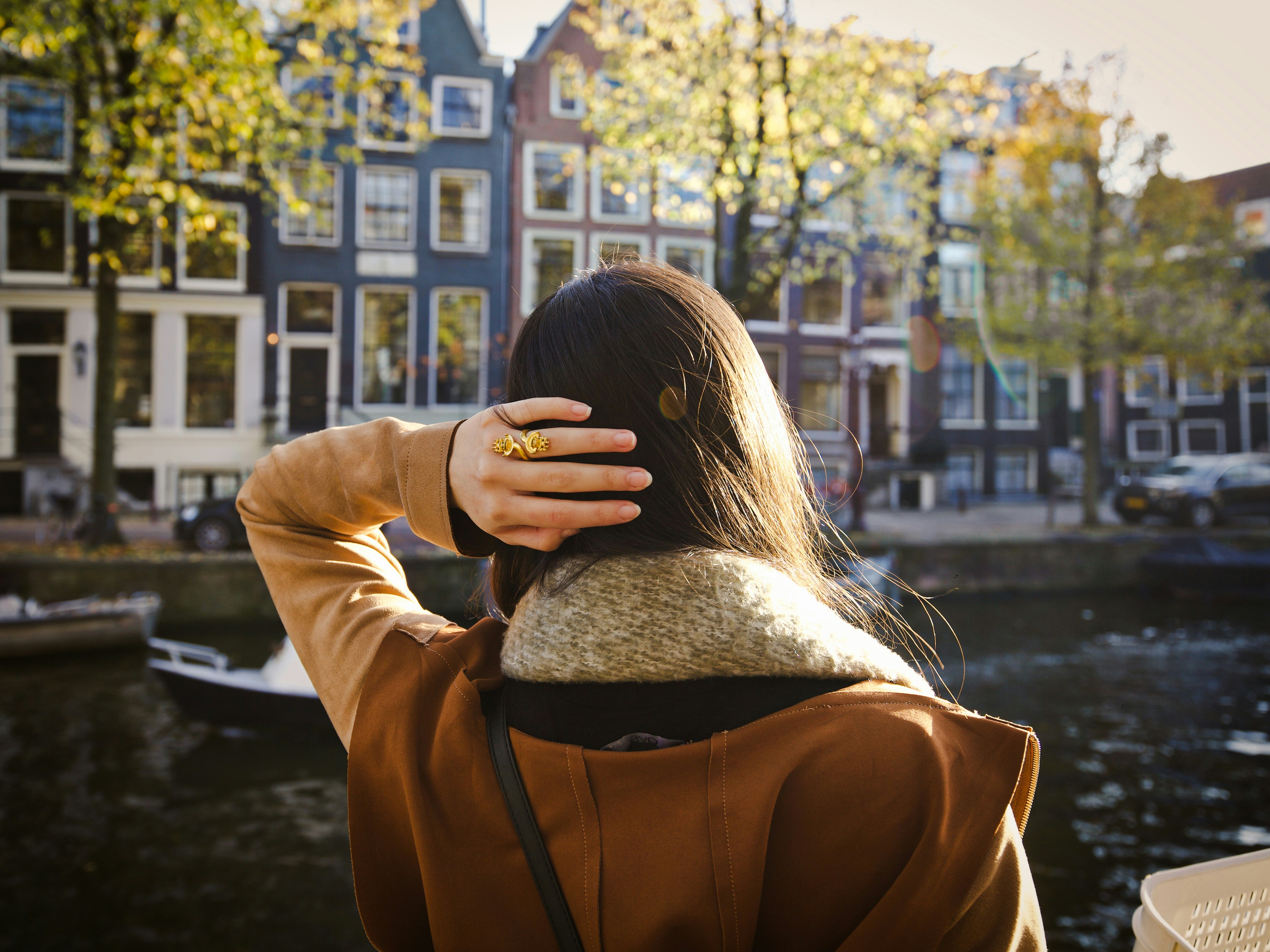 Woman in brown jacket covering her face with her hands photo – Free ...