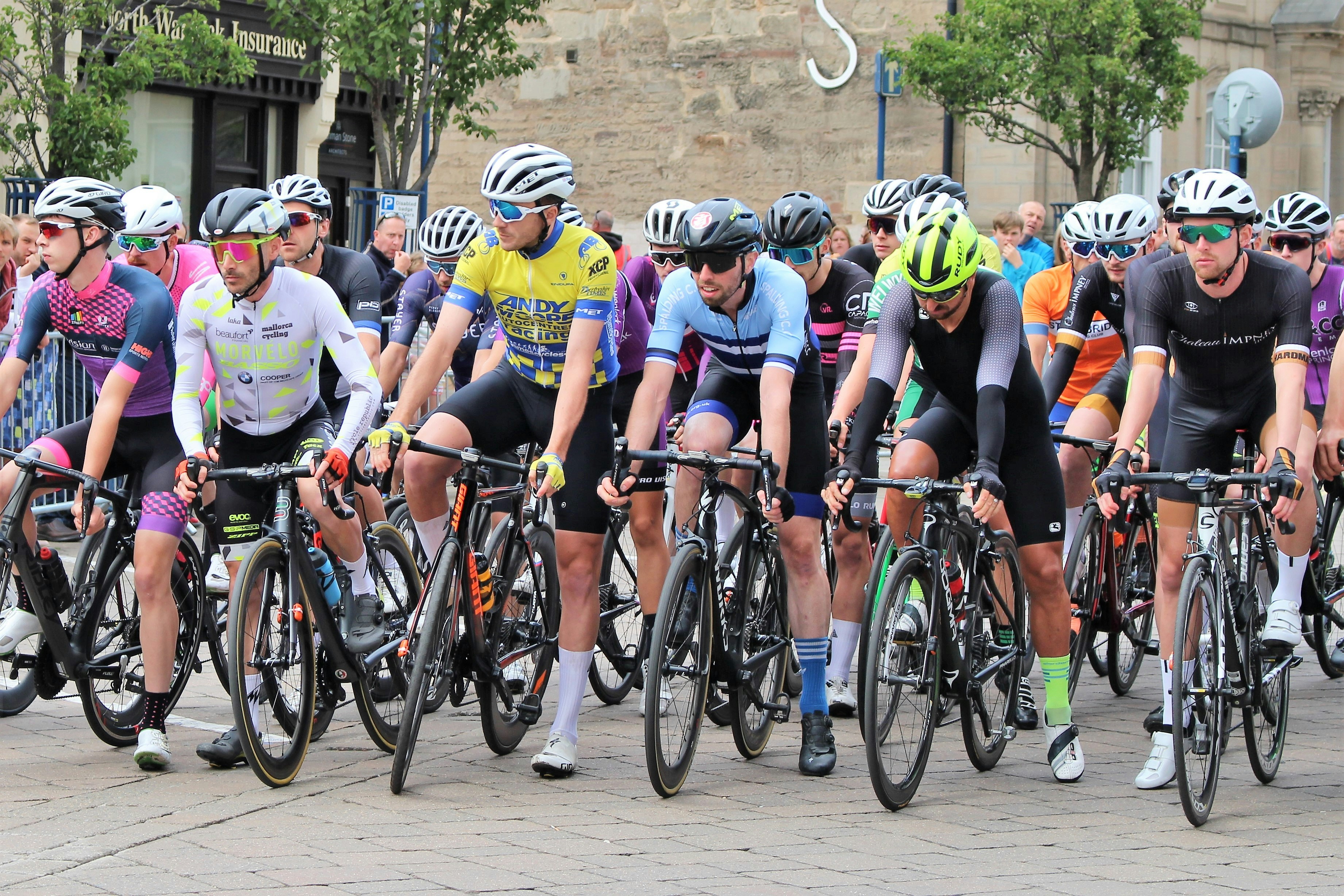 Men riding bicycle on road during daytime photo – Free Human Image on ...