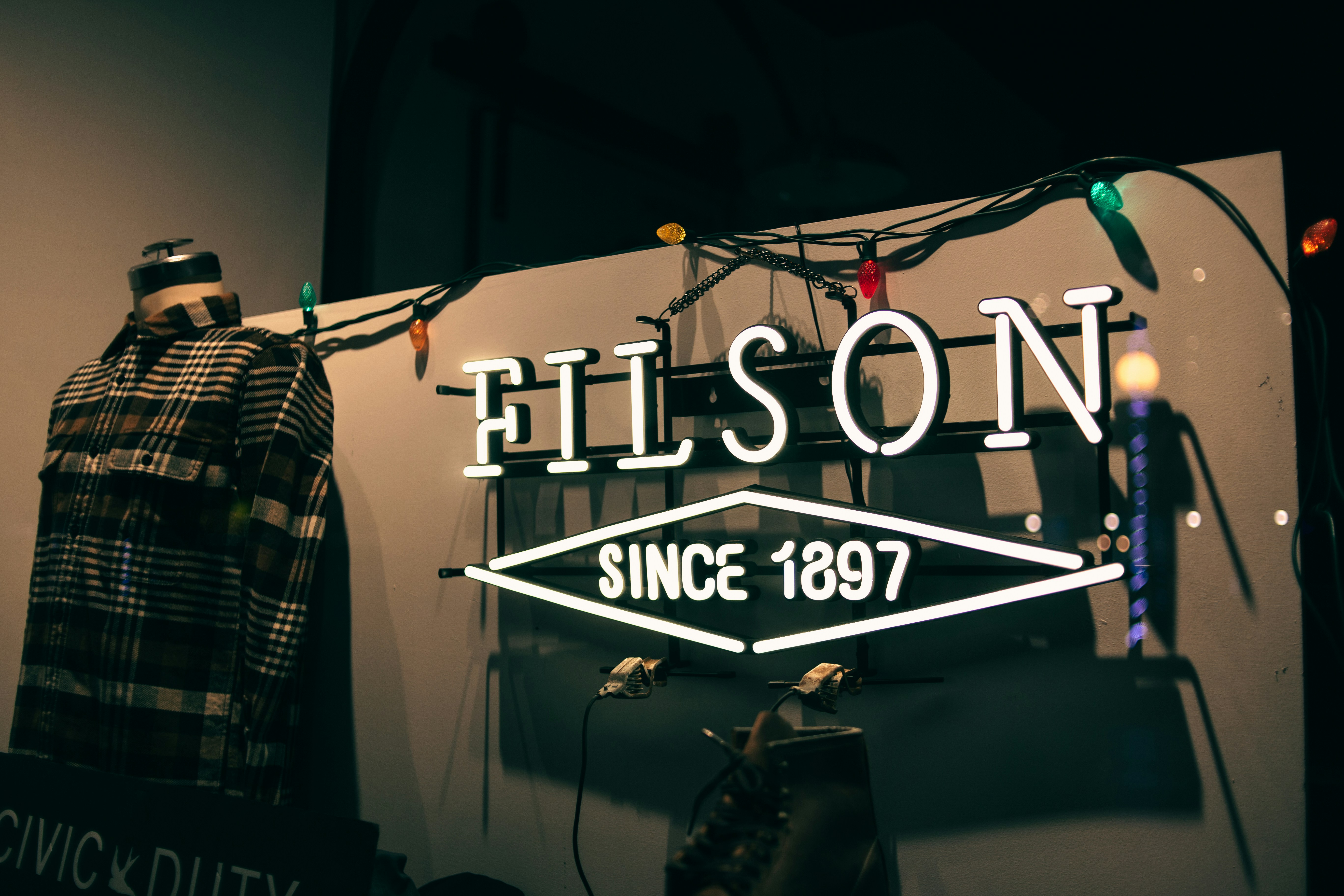 A neon sign that reads gibson since 1897 photo – Free Person Image on ...