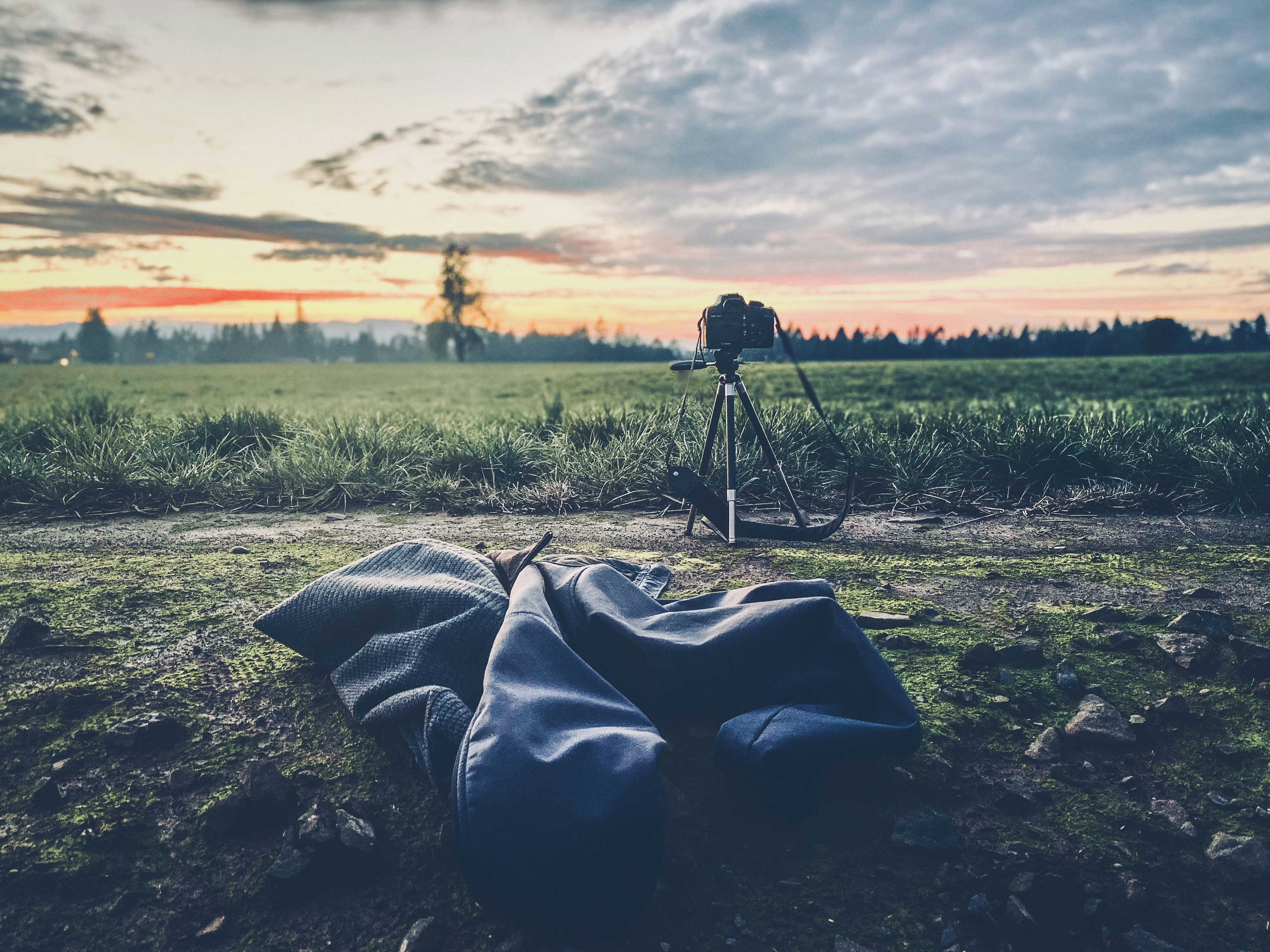 Dusk Field Studio: A Tripod Guards the Quiet Horizon