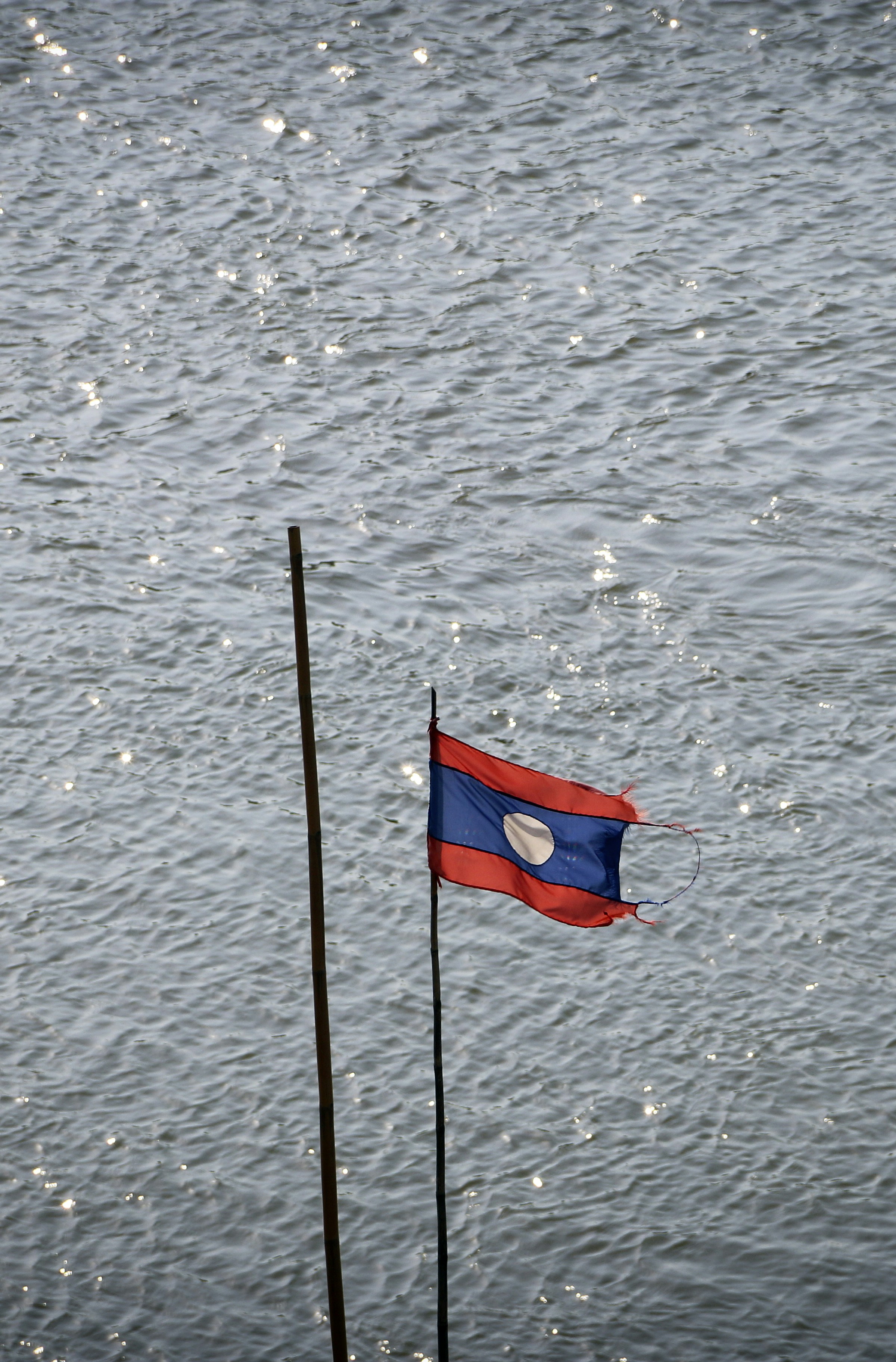 Blue and red flag on pole on body of water photo – Free Luang prabang ...