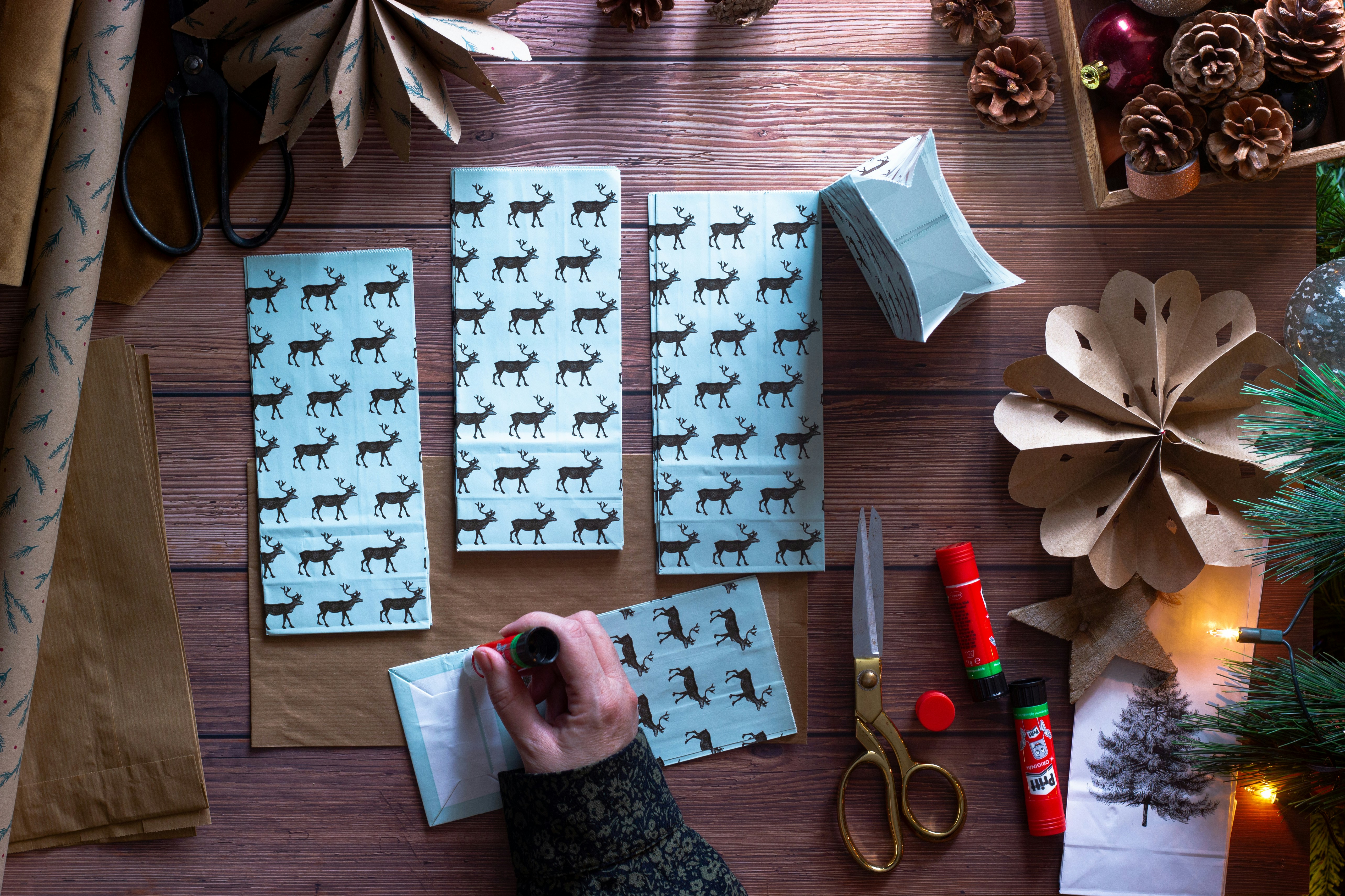 Reindeer-Patterned Wrapping Studio: A Cozy Desk of Holiday Crafting