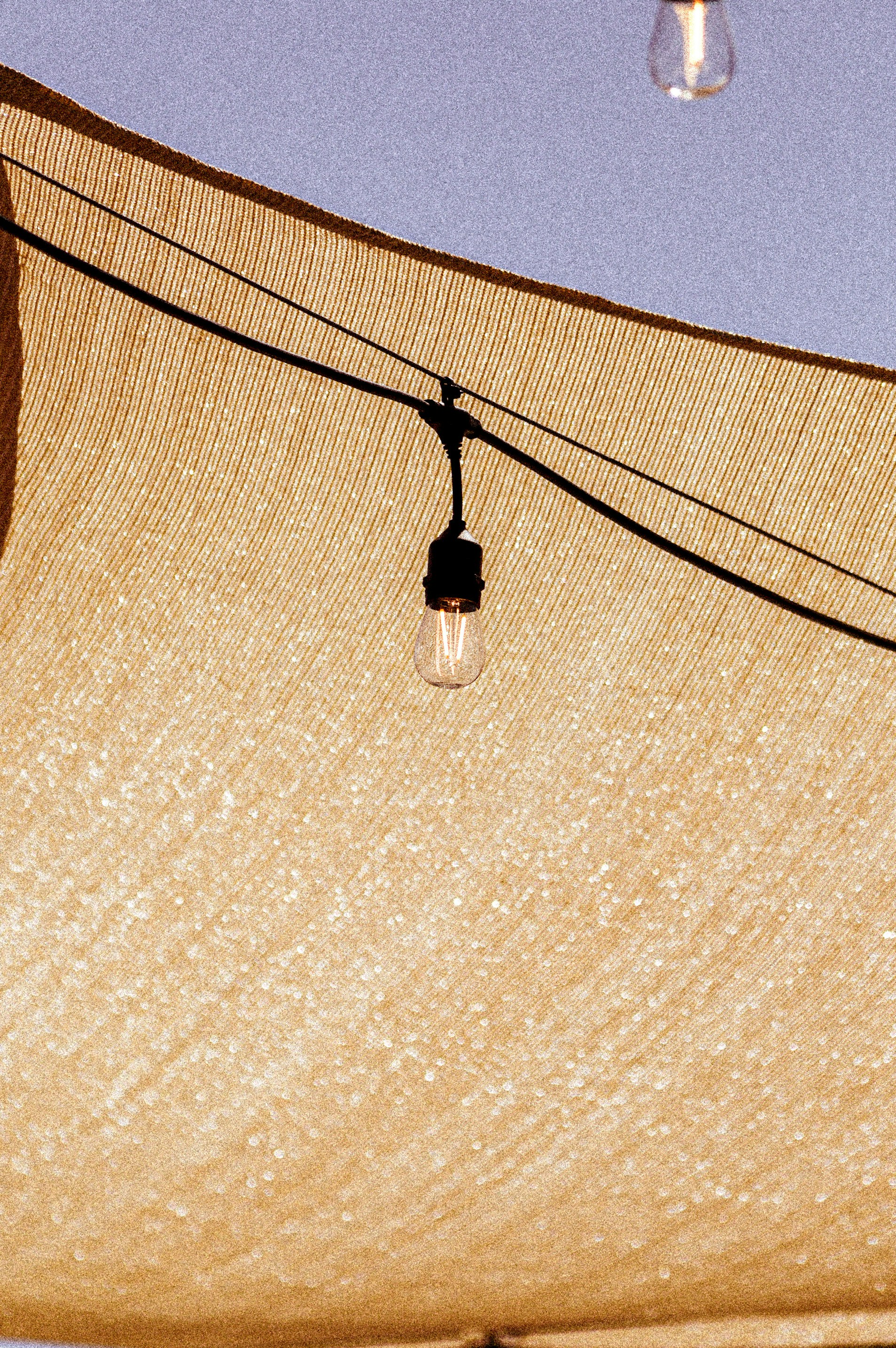 One Bulb, One Glow: Warm Light on a Sand-Textured Shade