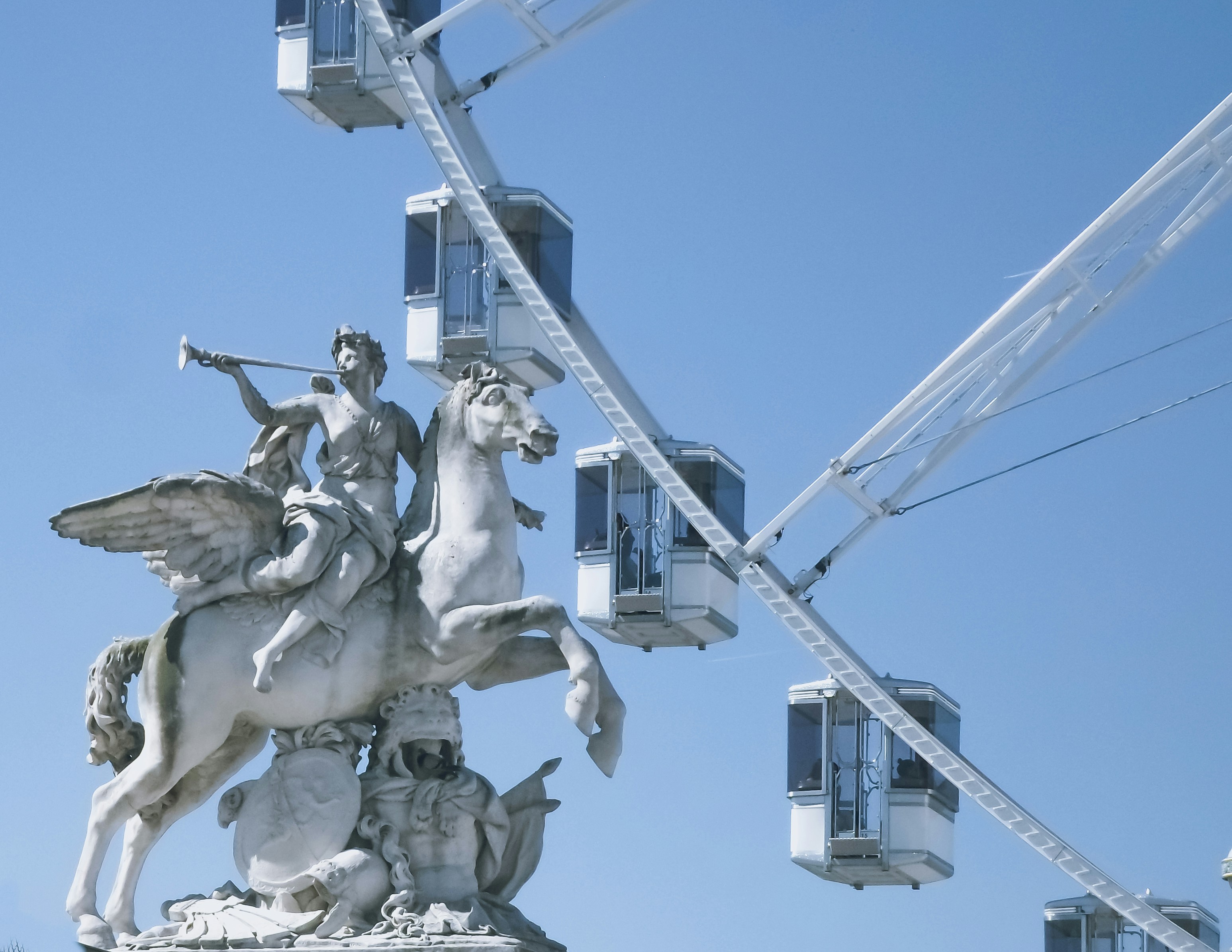 white concrete statue of man riding horse