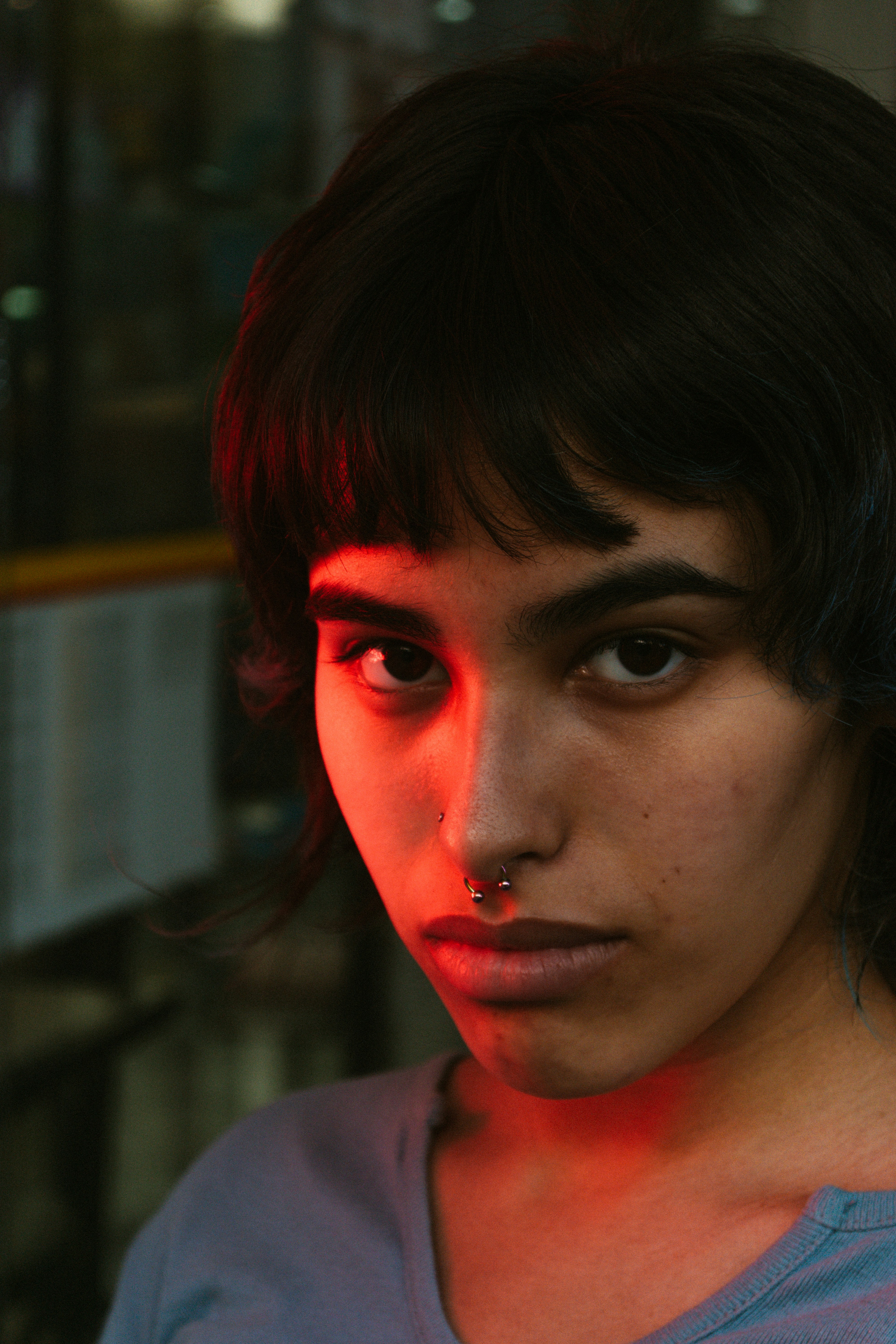 Crimson Gaze: A Moody Close-Up under Neon Red Light