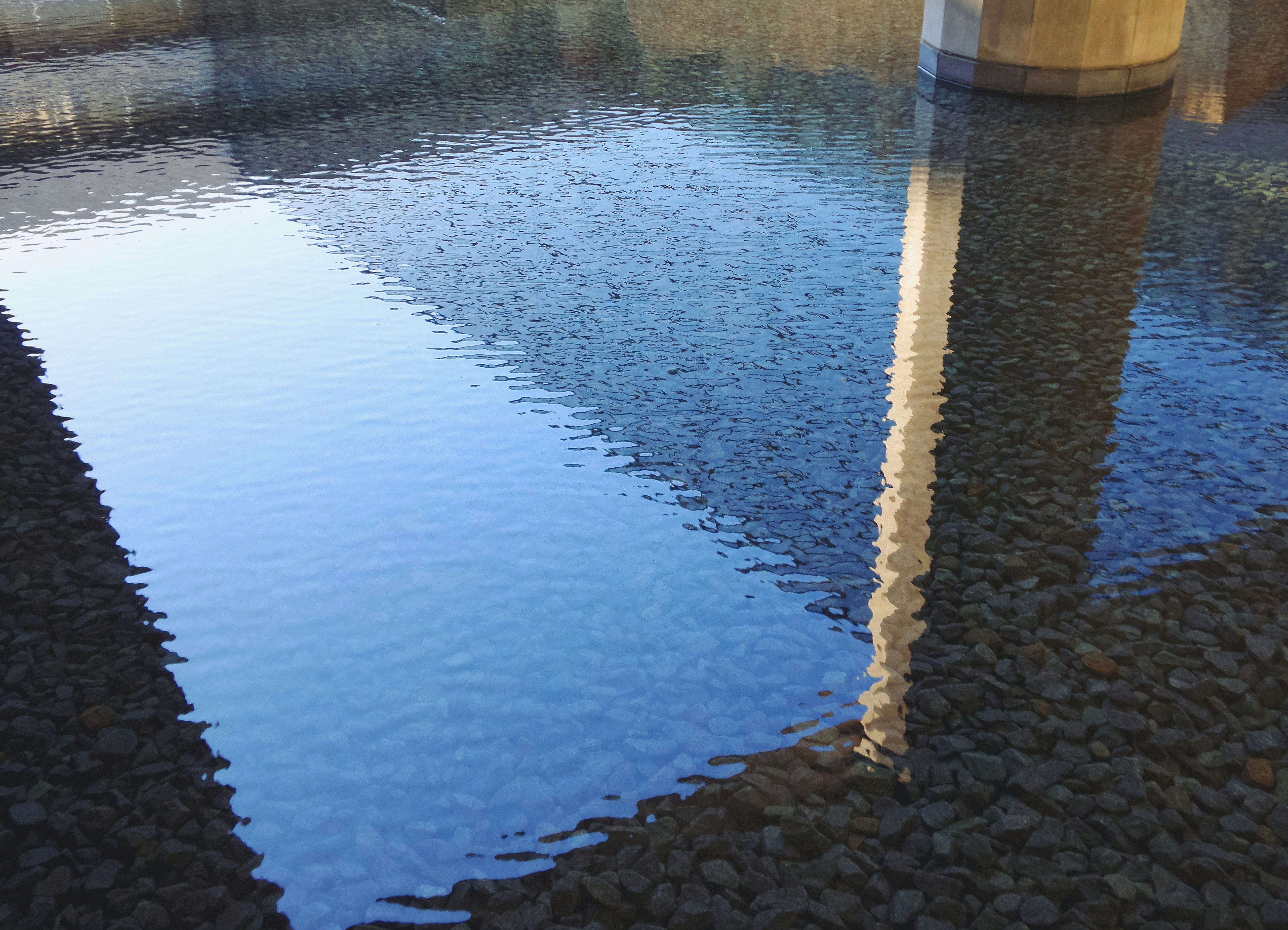Blue Reflection Under the Pier: Geometry of Water and Concrete