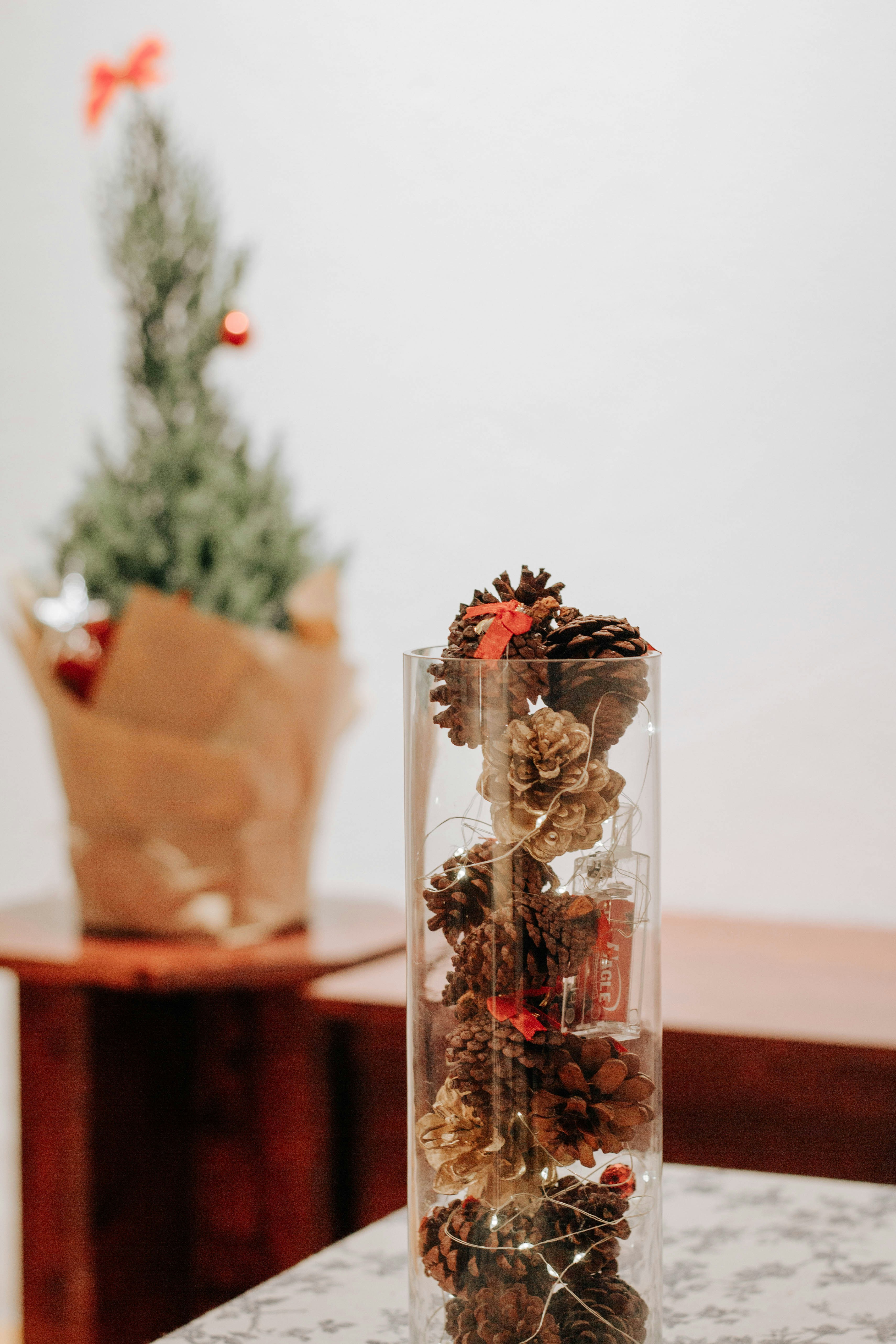 Pinecone Candle Tower on a Tabletop Mirth