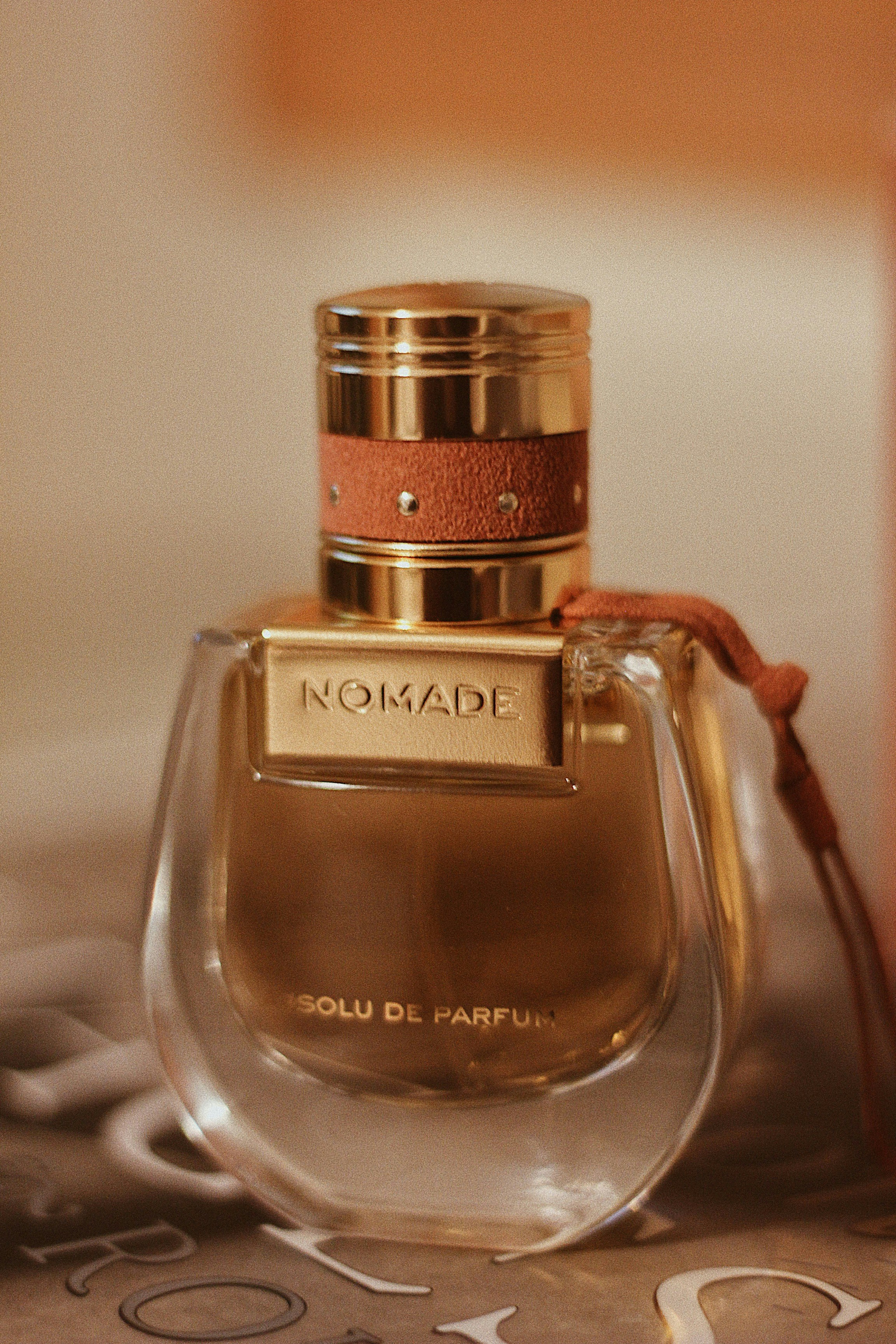 Nomade in Glass: An Amber Whisper of Perfume