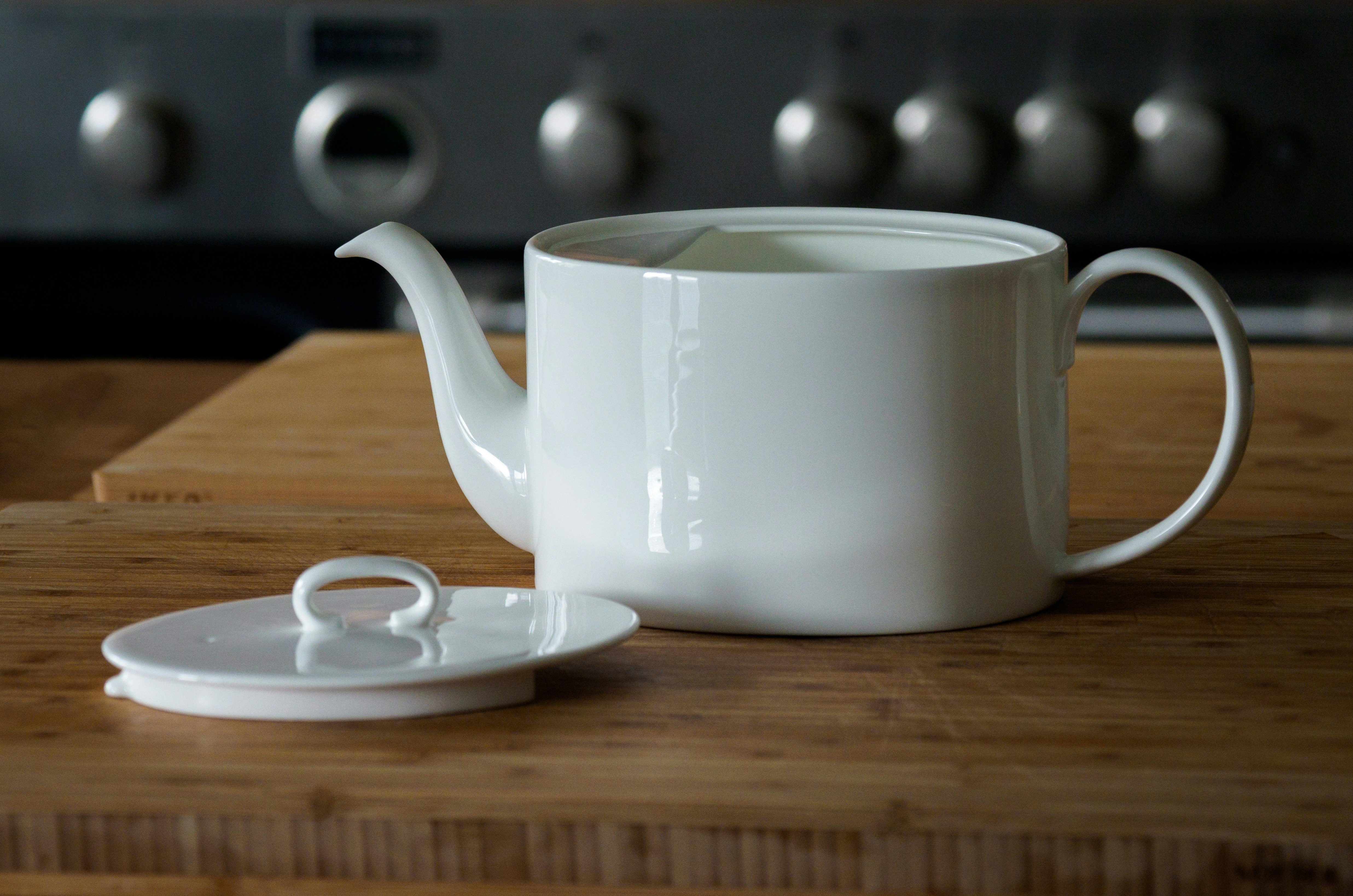 White Teapot on a Wooden Stage