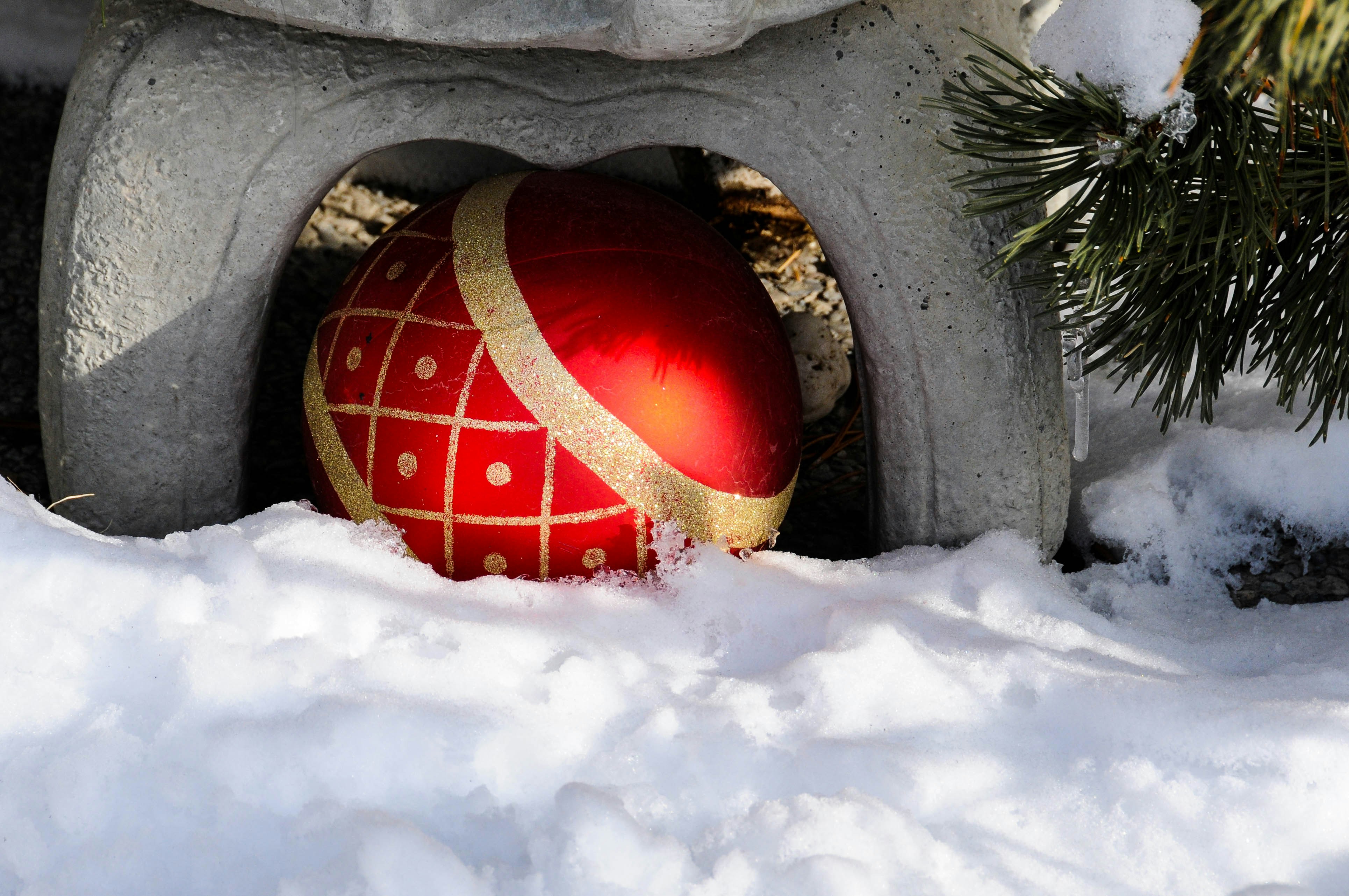 Red Ornaments in Snowy Niche
