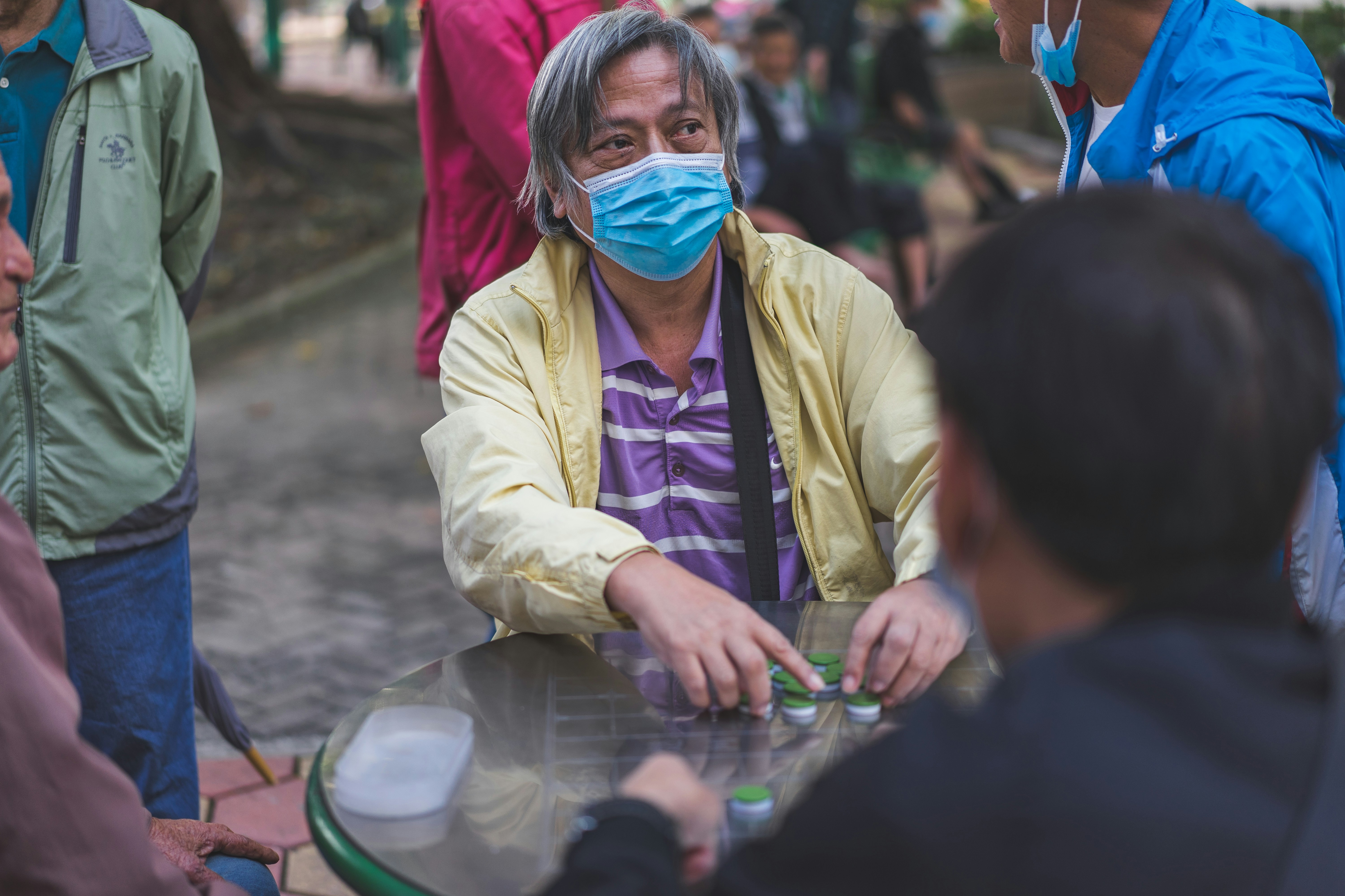 Muted Exchange at the Round Table: A Masked Street Moment