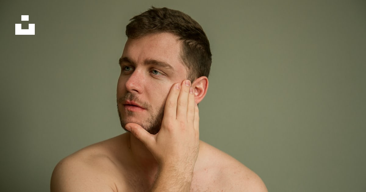 Topless Man Covering His Face With His Hand Photo Free Man Image On Unsplash