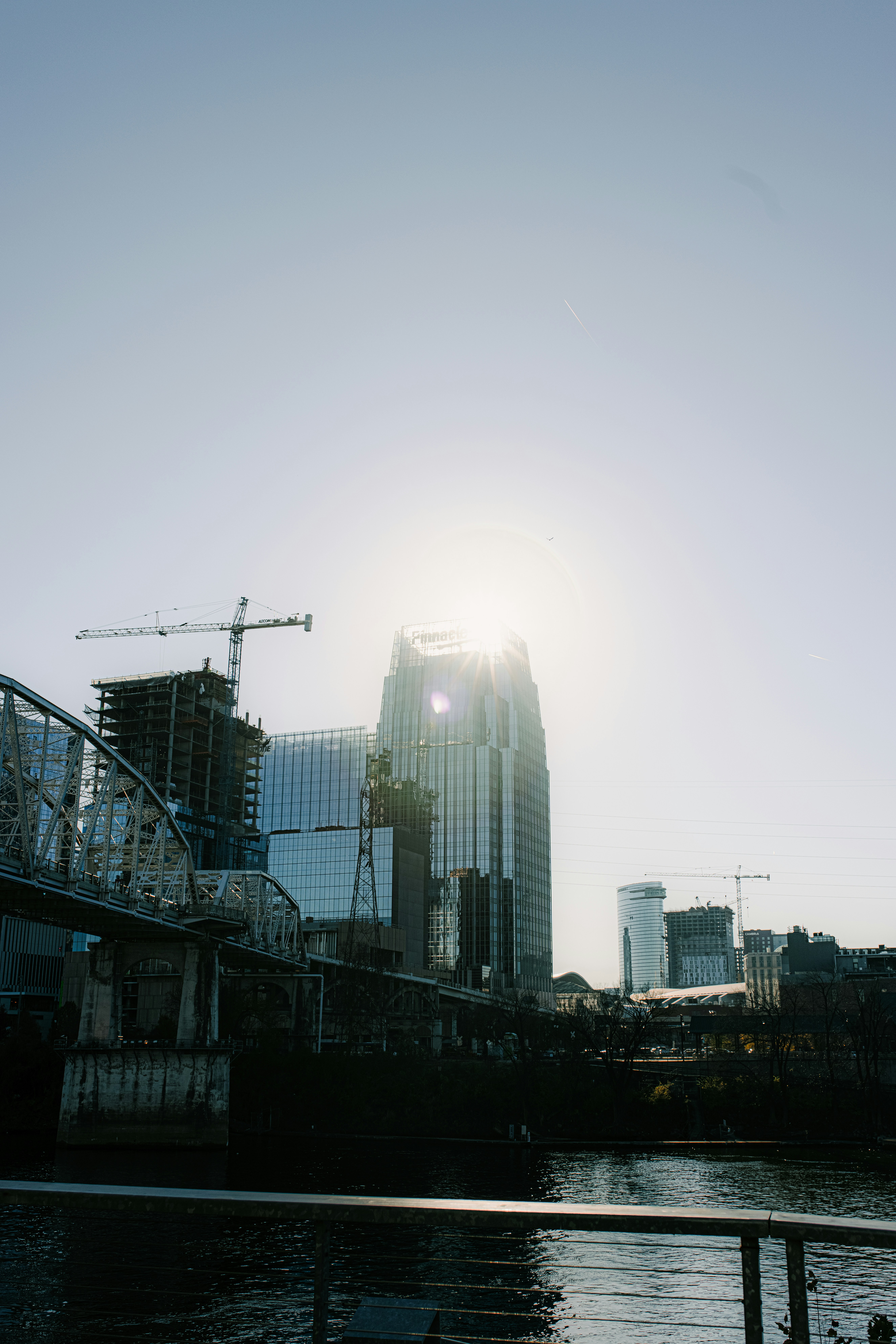 the sun shines brightly over a large city