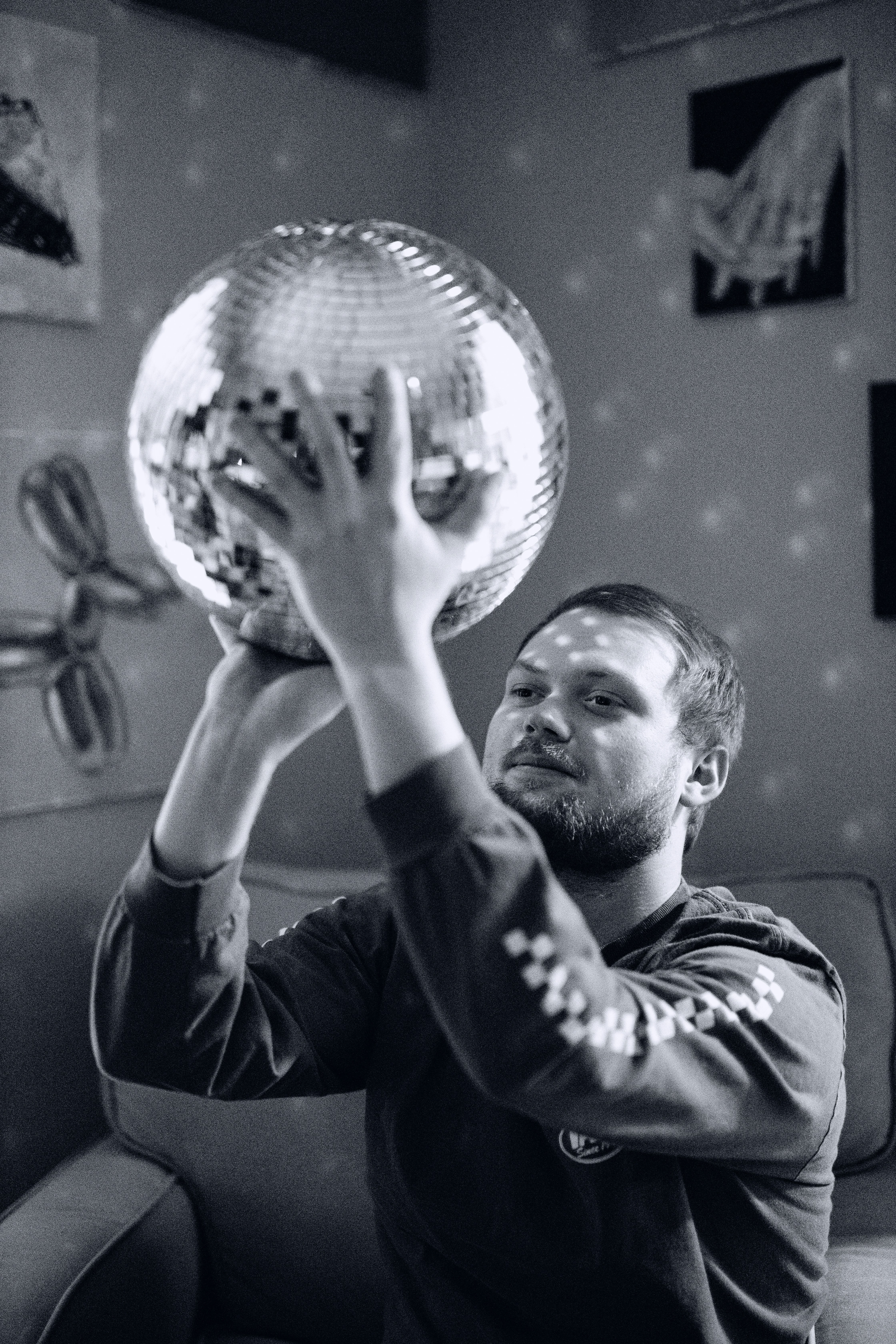 Glittering Orbit: A Quiet Portrait with a Disco Ball