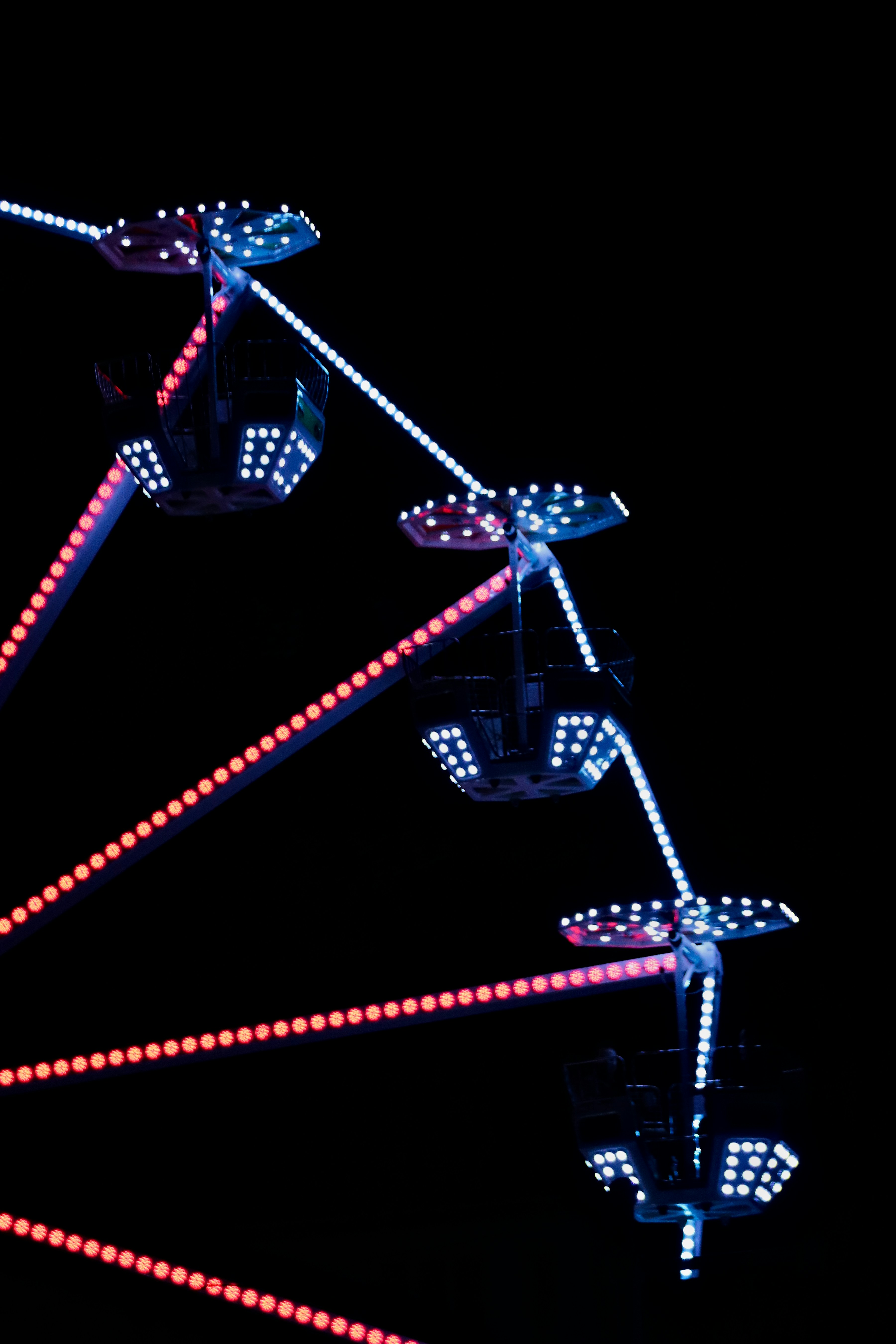 Neon Gondolas Along a Diagonal Night Ride