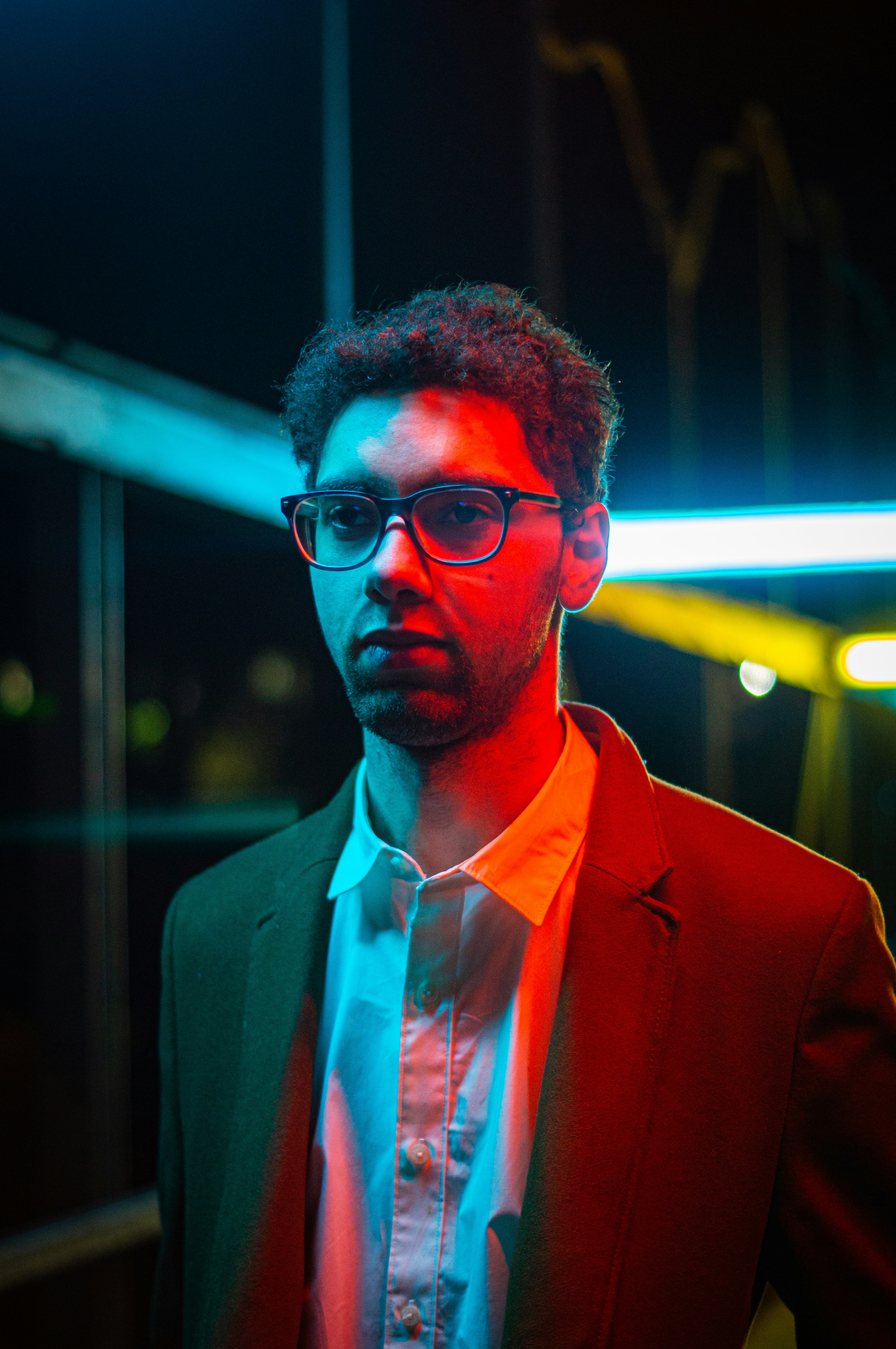 Neon-Tone Portrait: A Tailored Moment Under Blue-Red Nightlife Glow