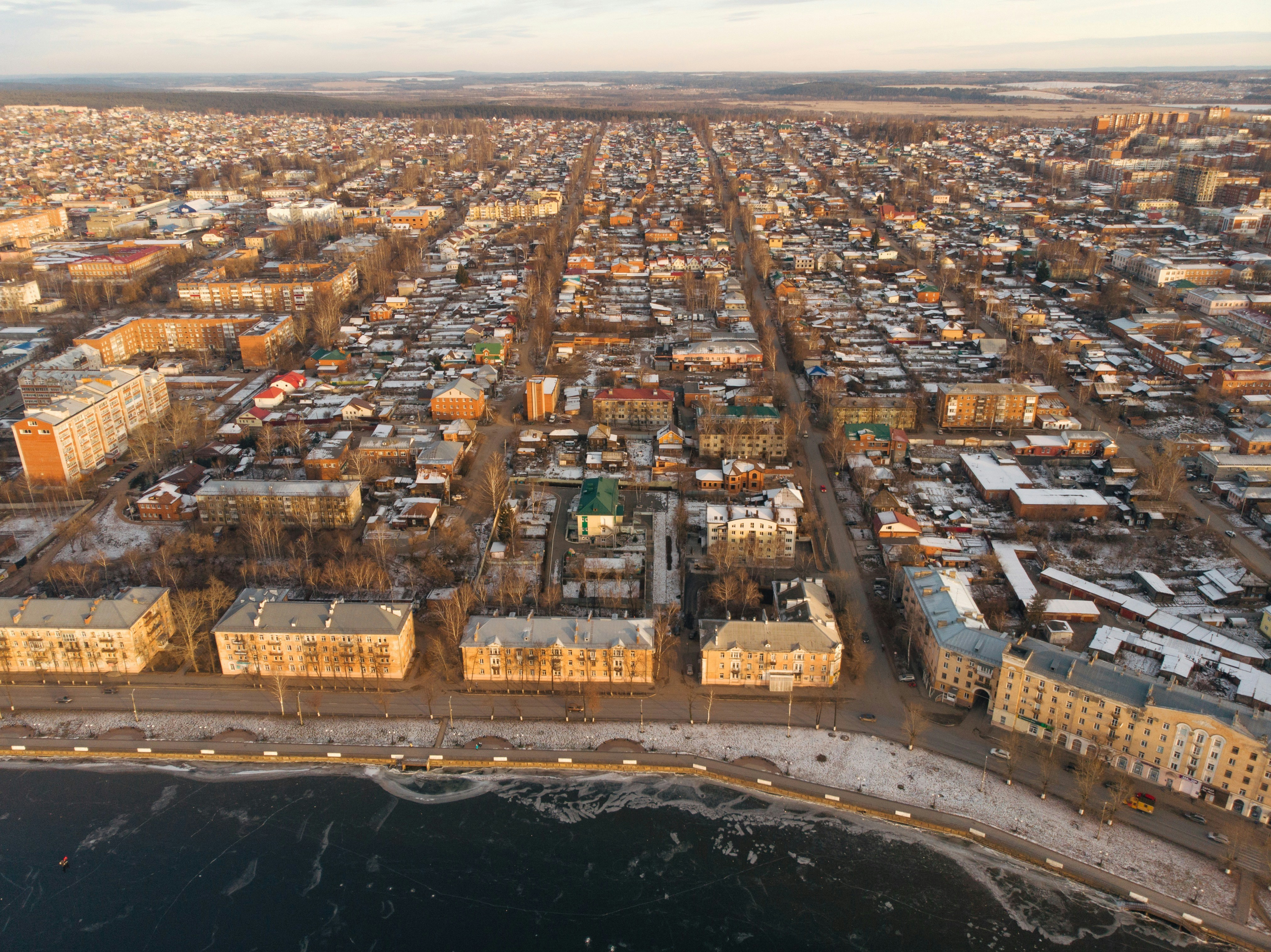 Golden Hour Grid: Aerial Patchwork Over a Coastal City