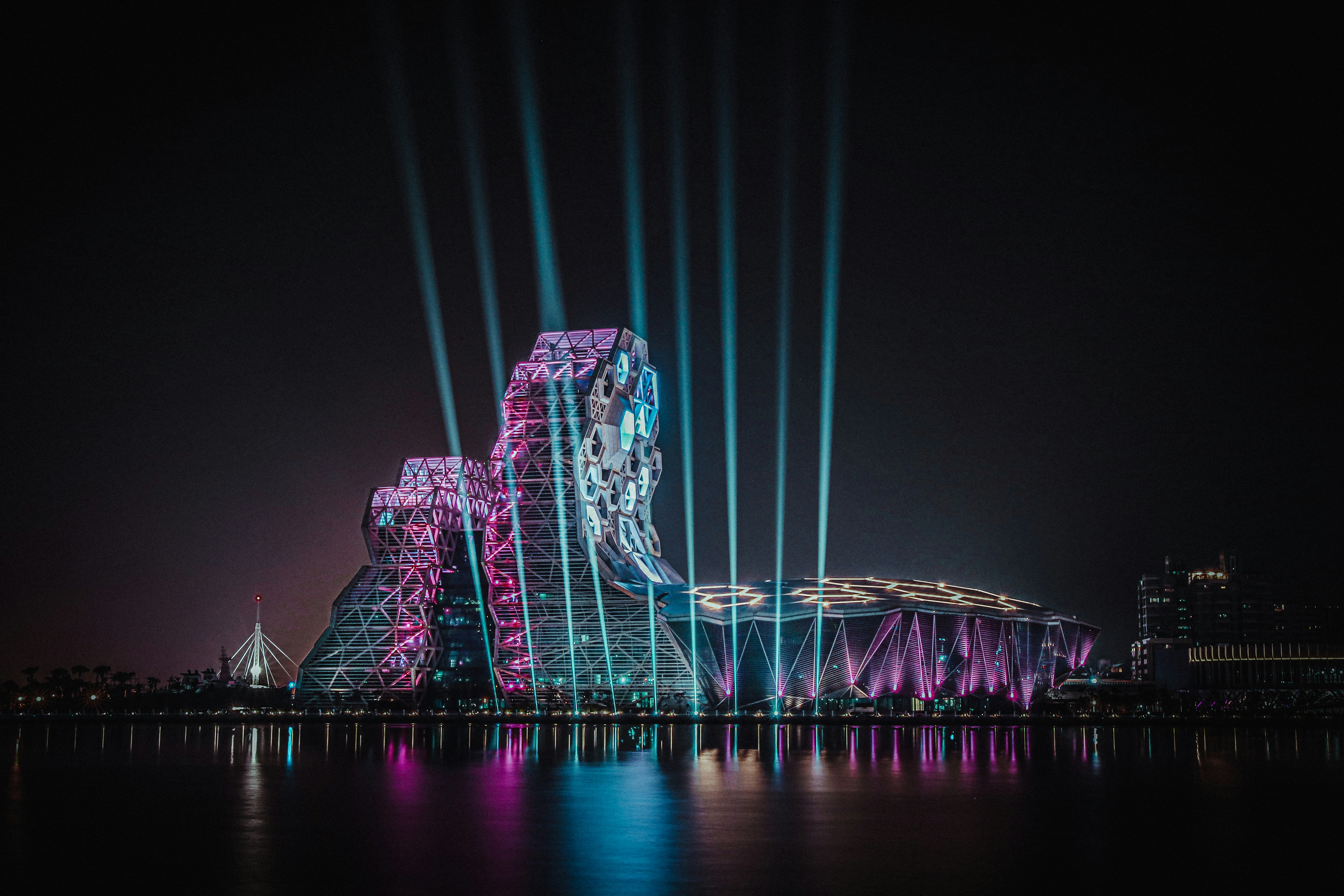 purple lighted bridge over water