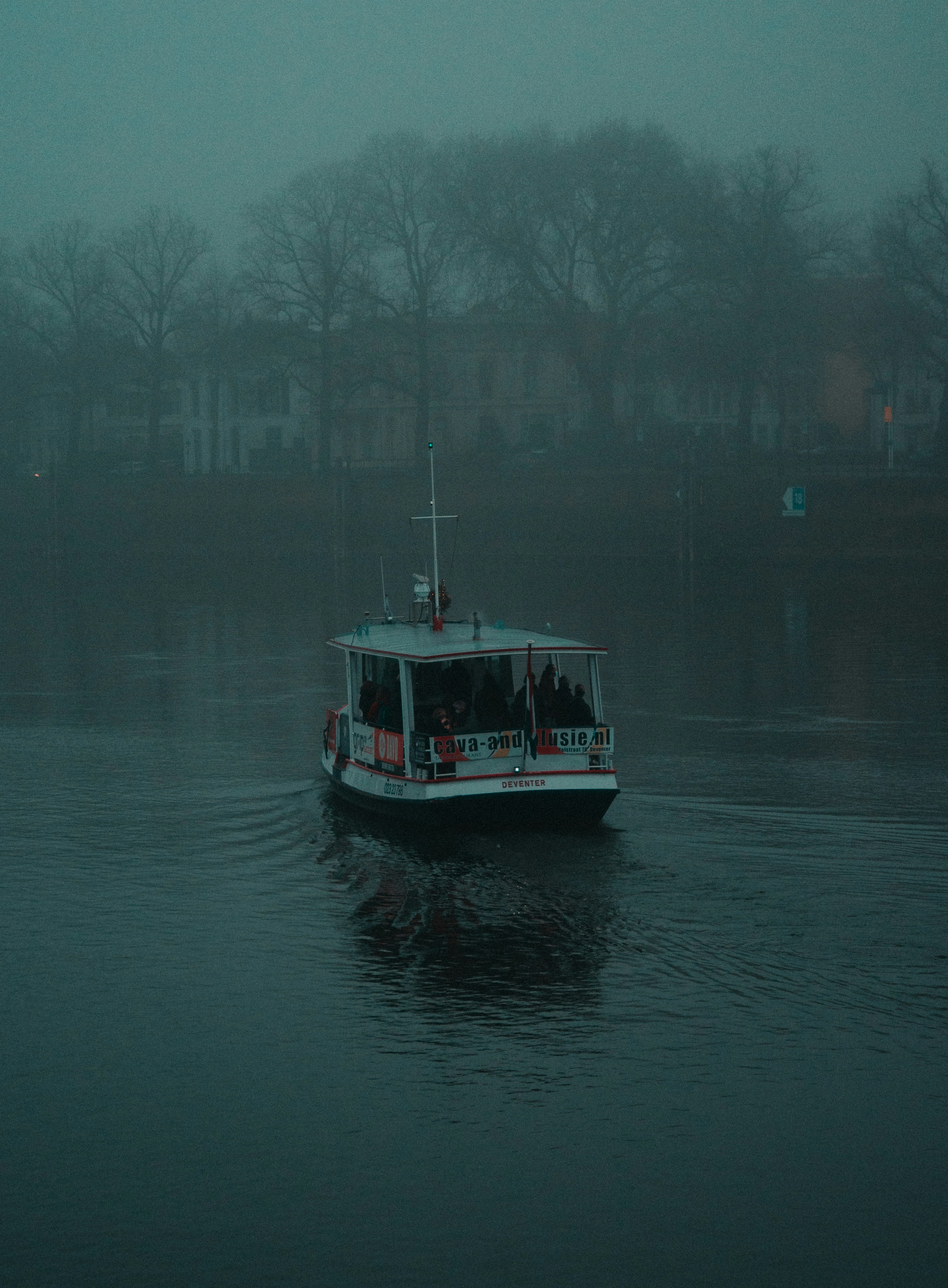 Mist-Quiet Riverboat Drifting Through Twilight Fog