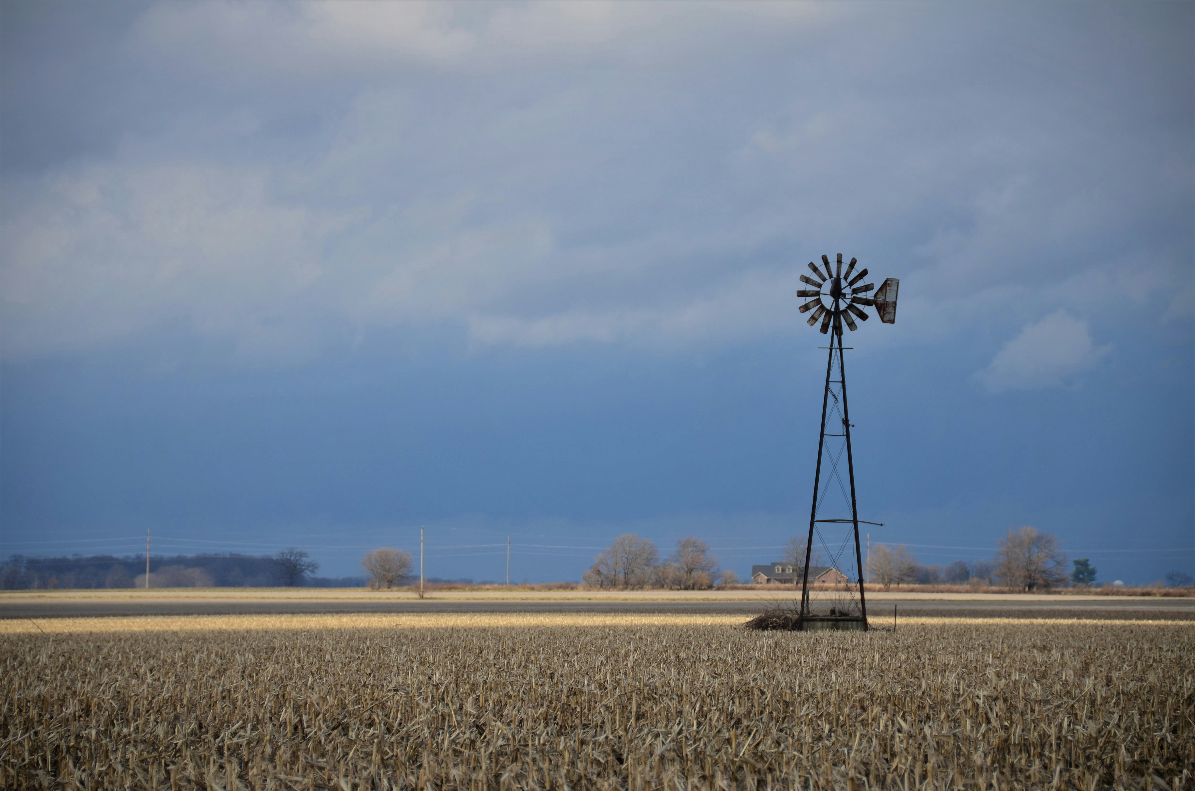 Windmill on brown field under blue sky during daytime photo – Free Grey ...