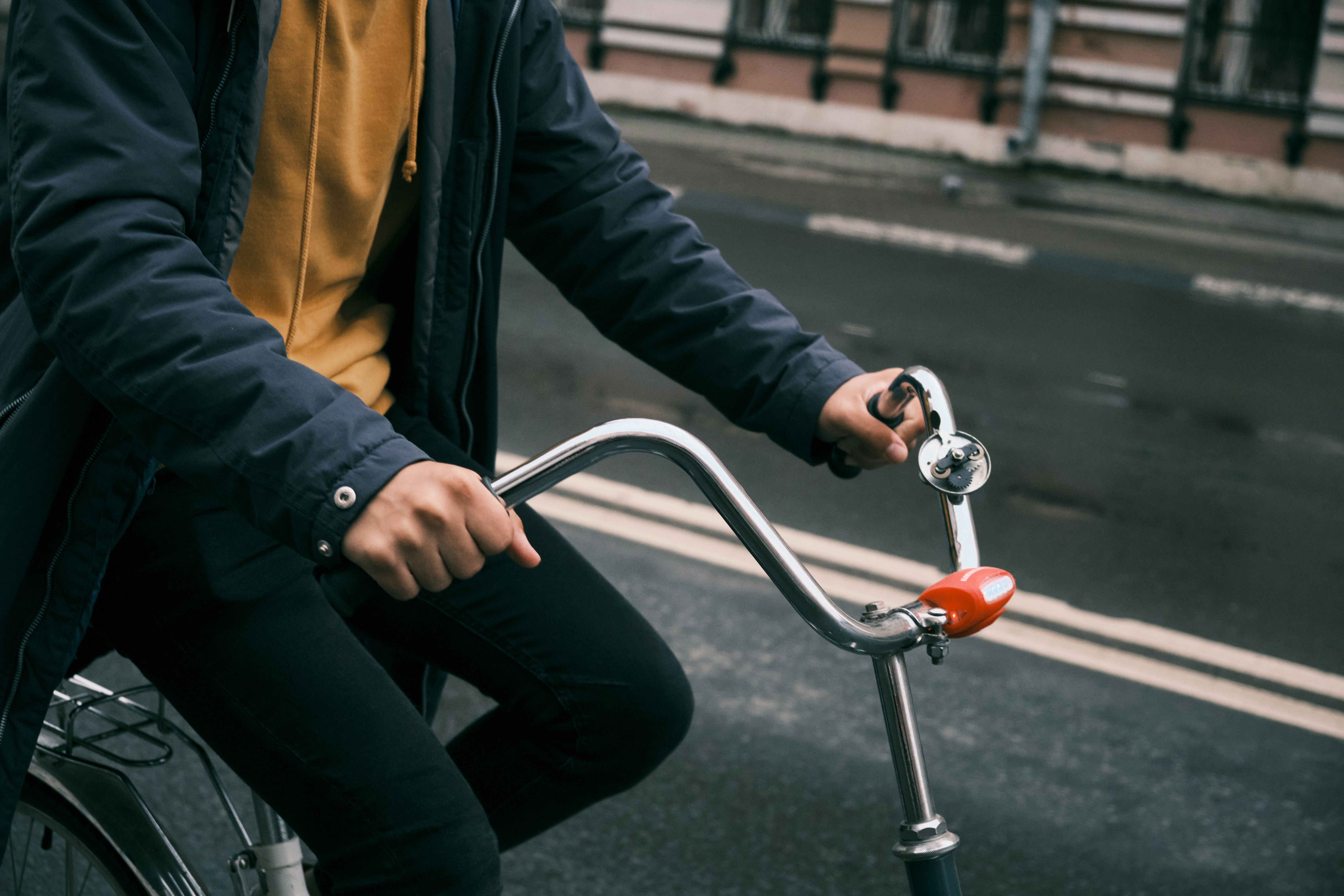 Chrome Grip in the City: A Quiet Moment on a Bicycle