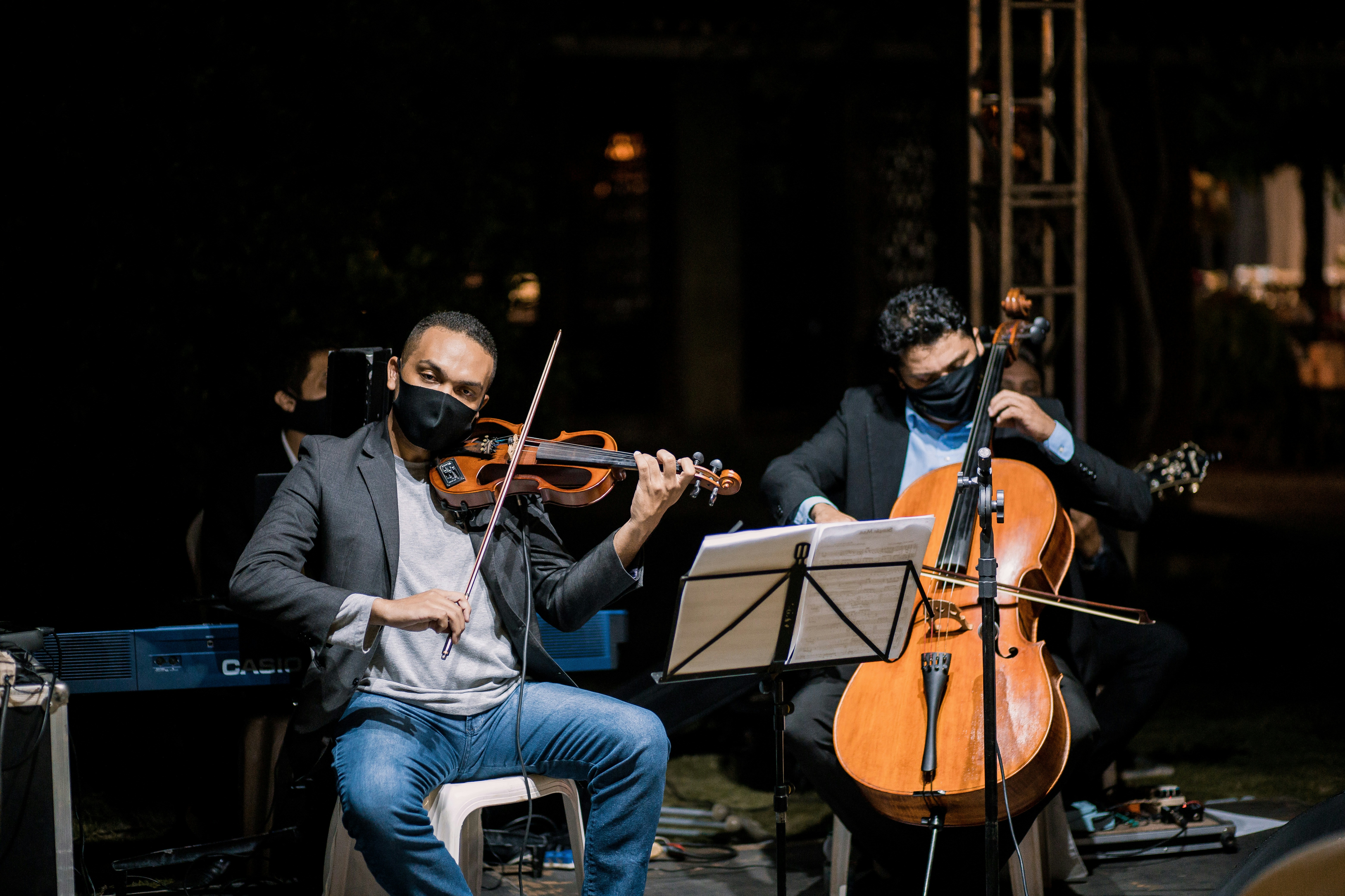 Man playing violin beside woman playing violin photo – Free Human Image ...