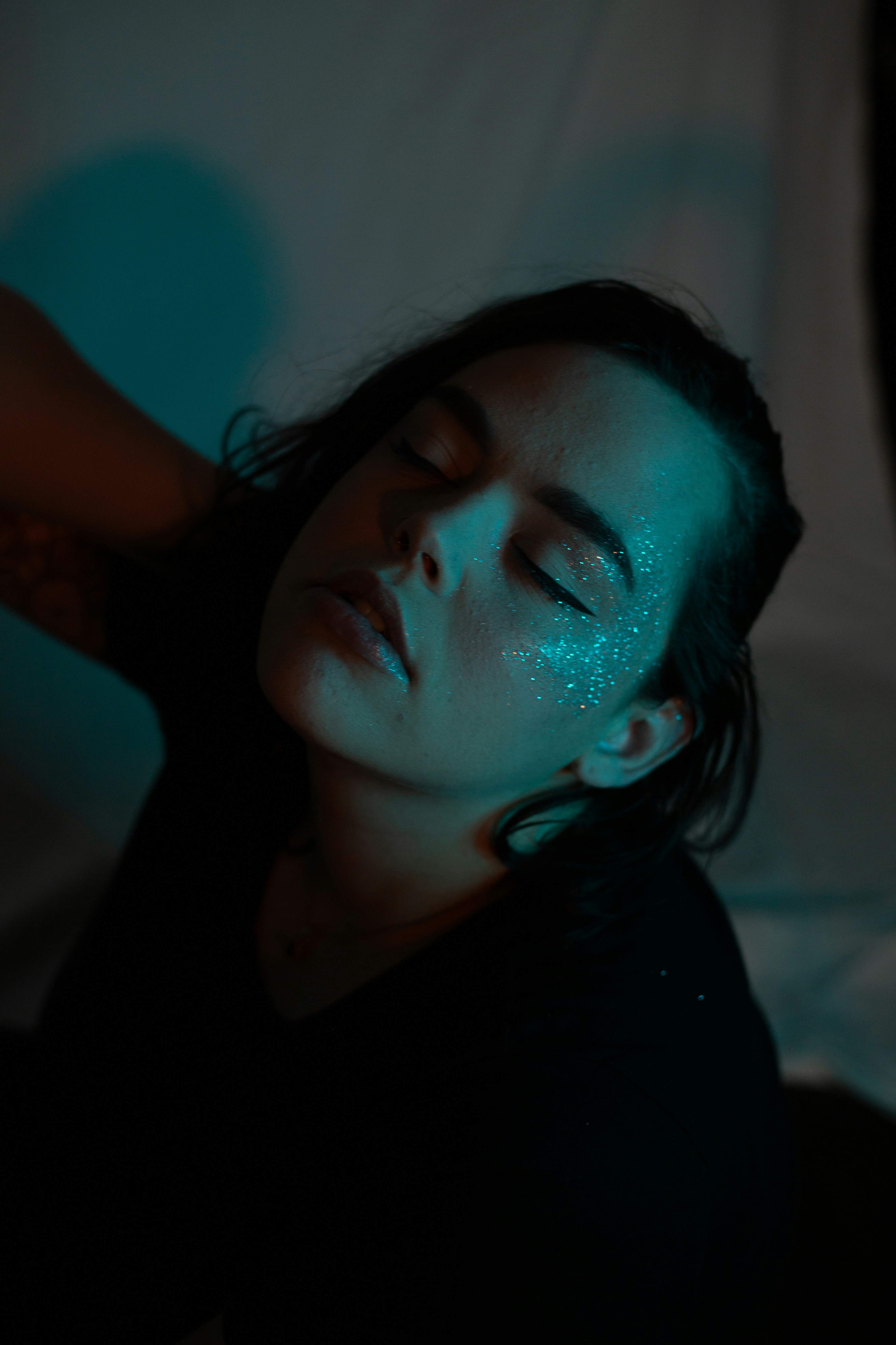 Teal Velvet Portrait: Glitter on a Quiet Face Beneath Moon-Washed Light