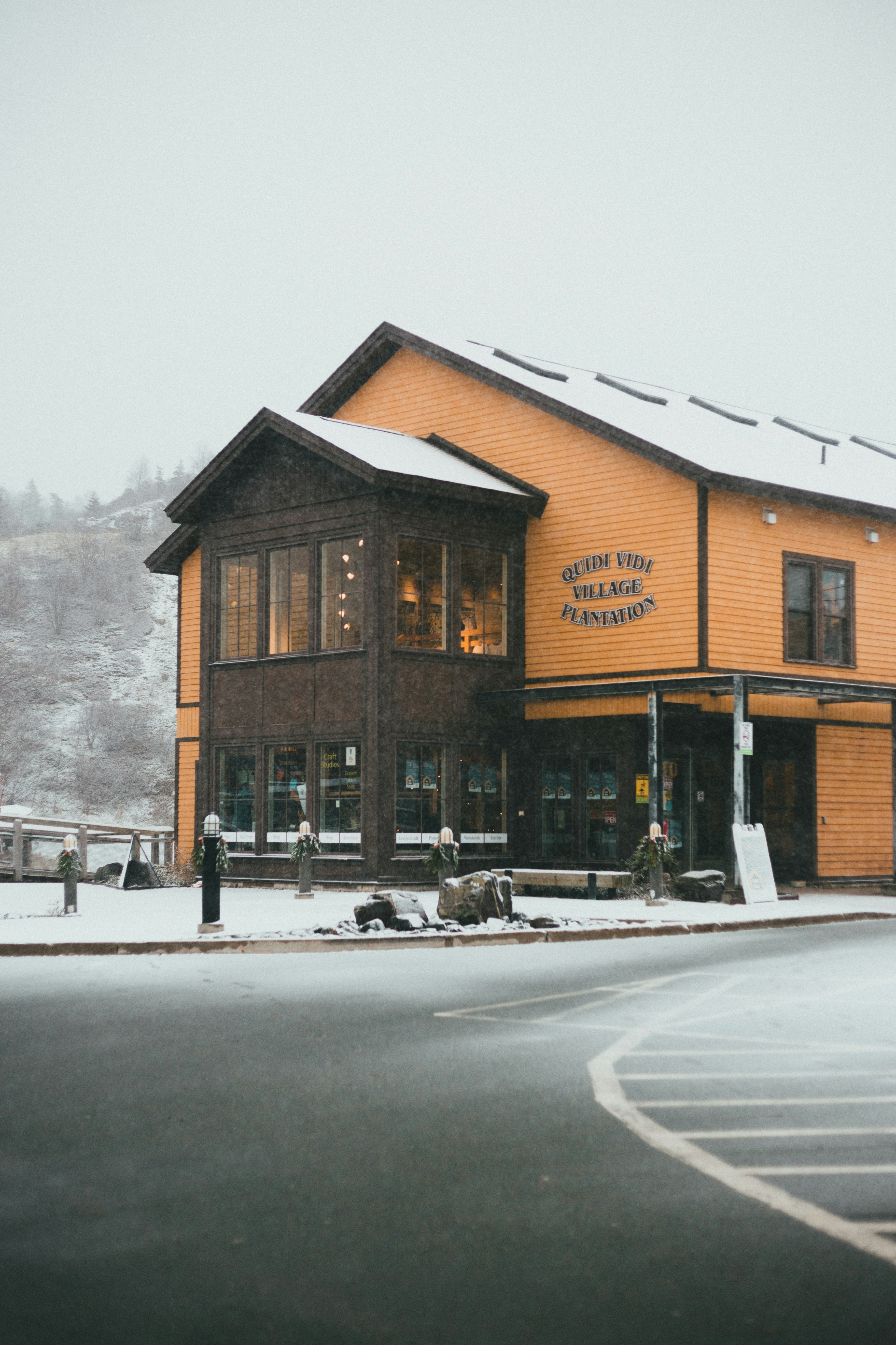Two-Tone Village Lodge Nestled in a Snowy Street Curve