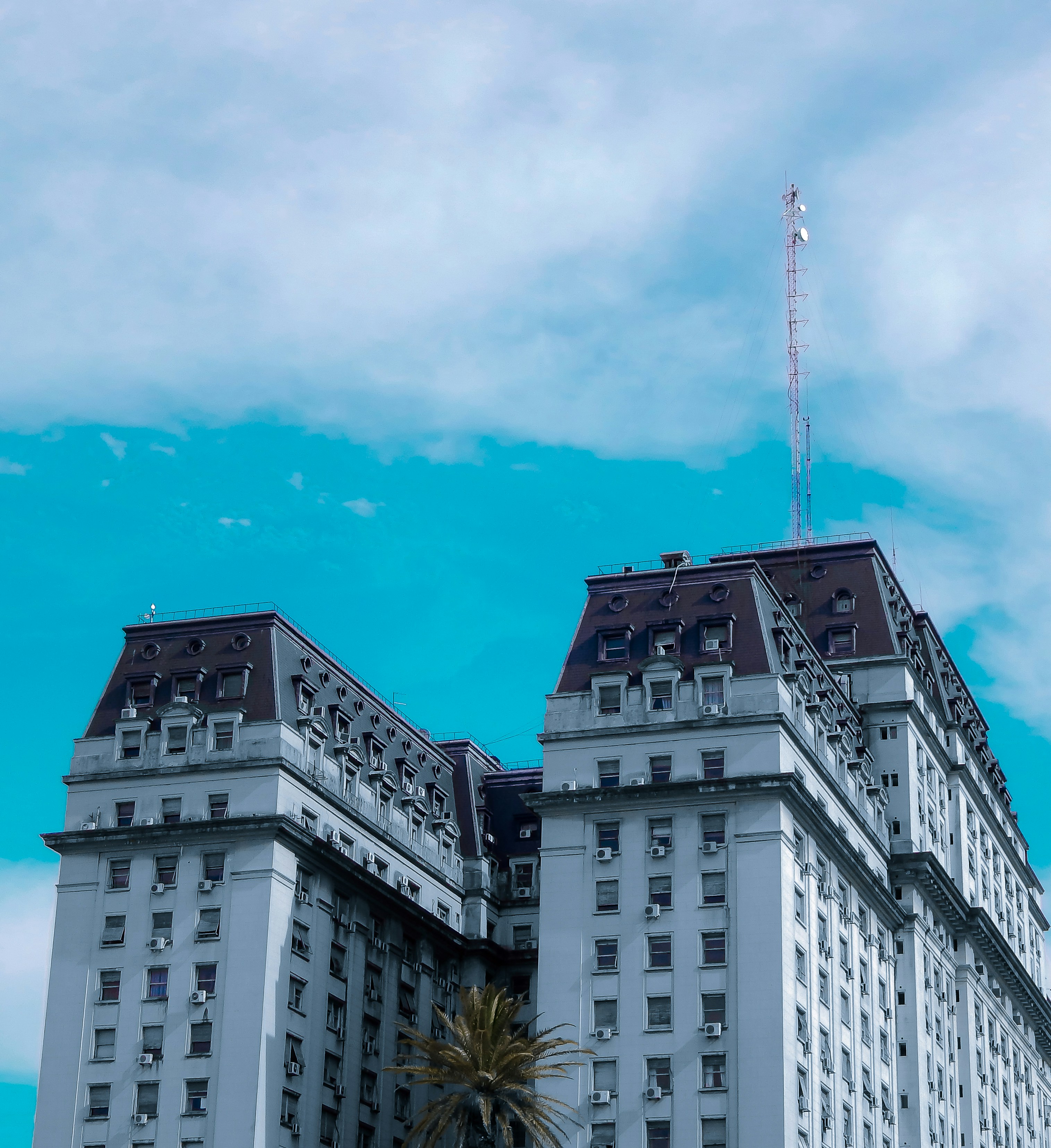 white concrete building under blue sky during daytime