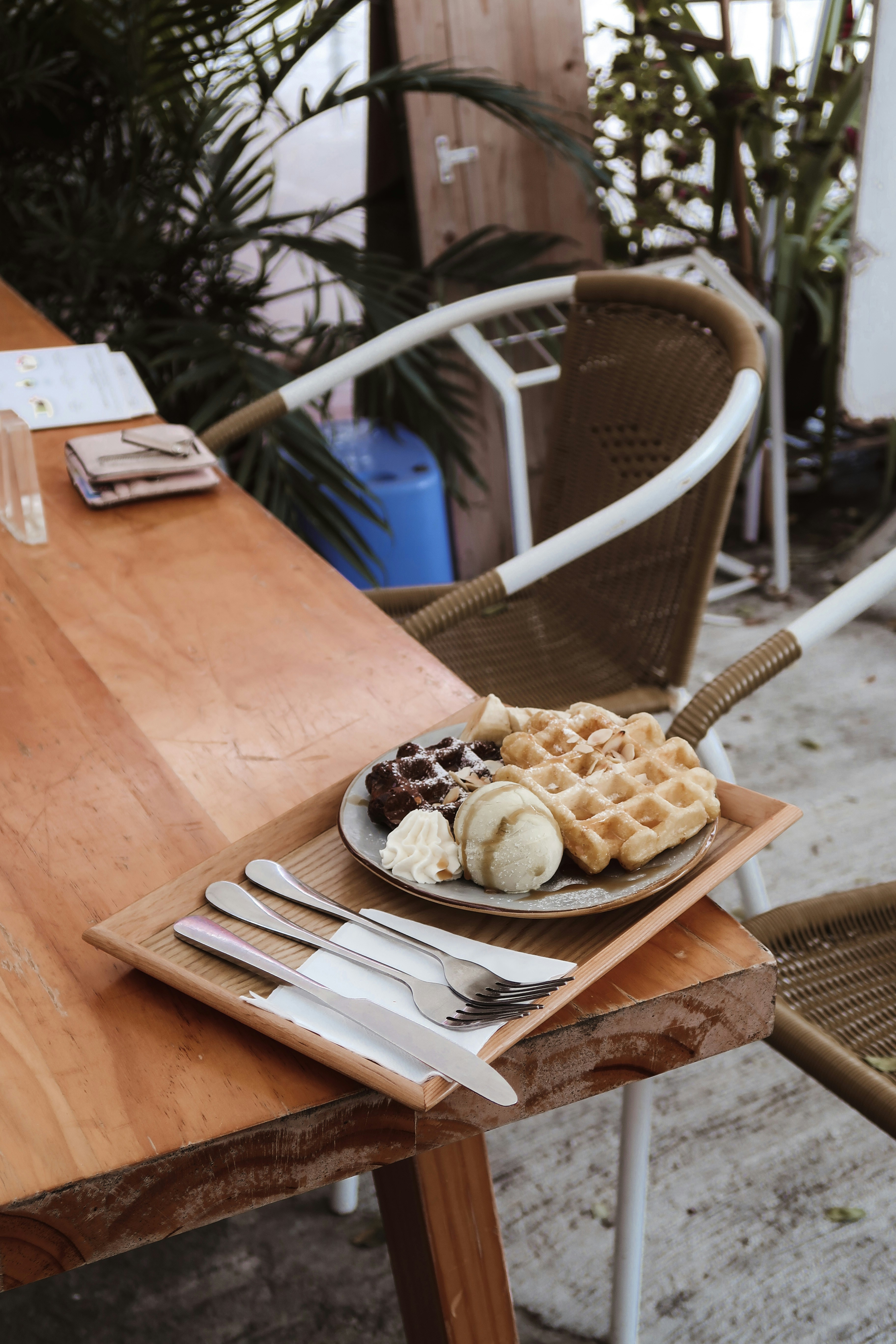 Golden Waffles on a Wooden Tray: Quiet Morning at a Garden Café