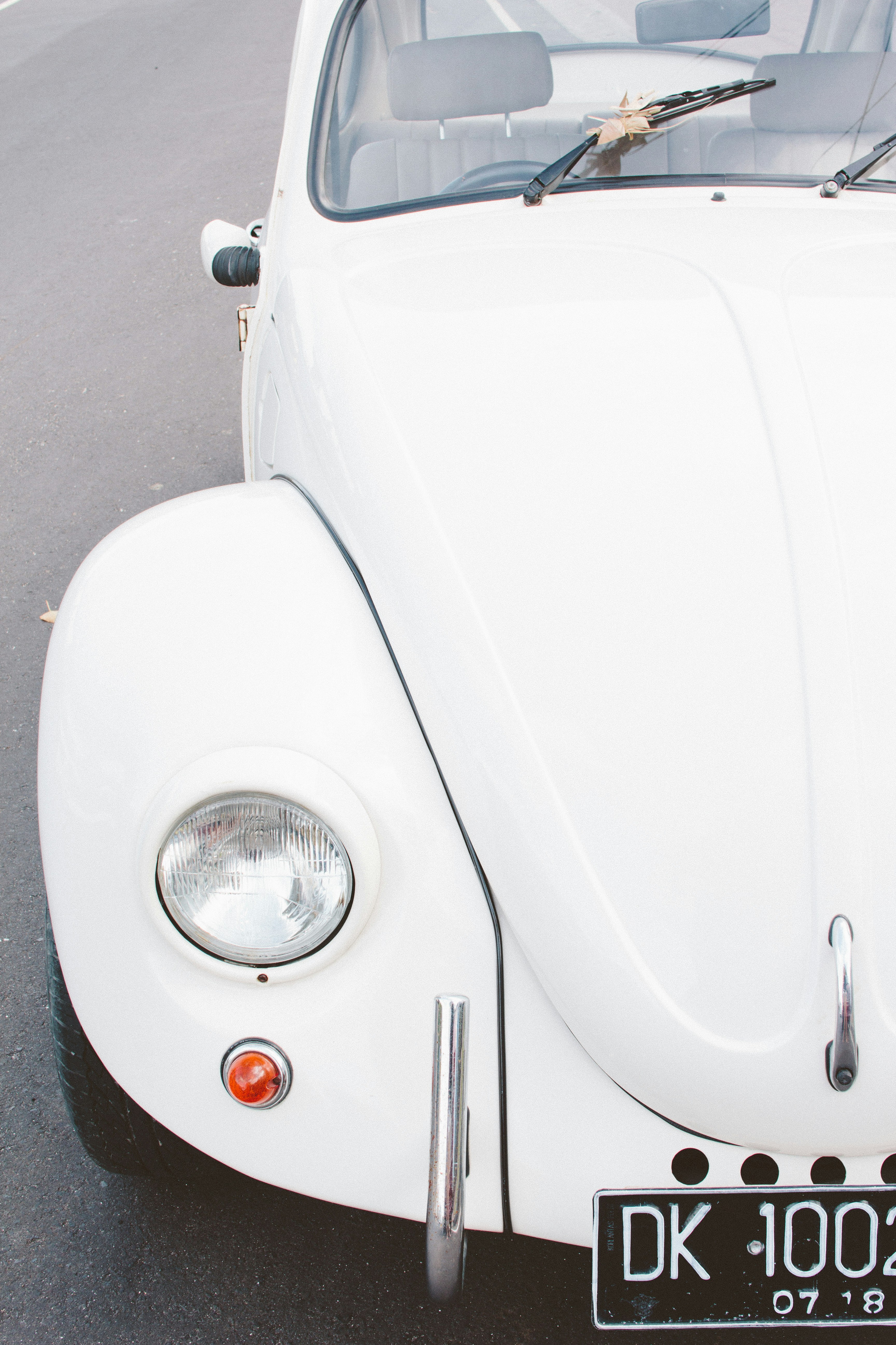 White Beetle Close-Up: Curves, Chrome, and a Quiet Street Moment