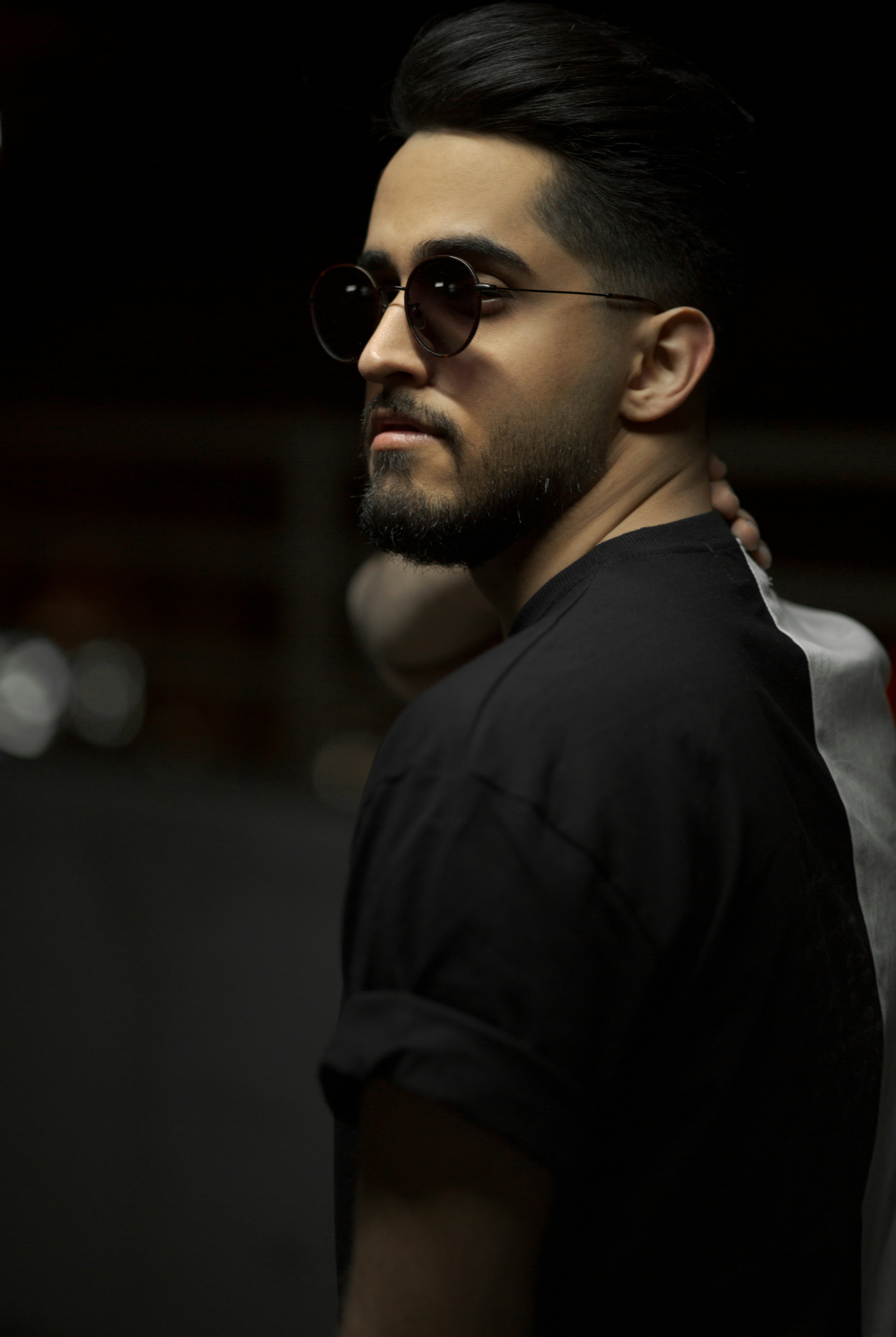 man in black jacket wearing black sunglasses