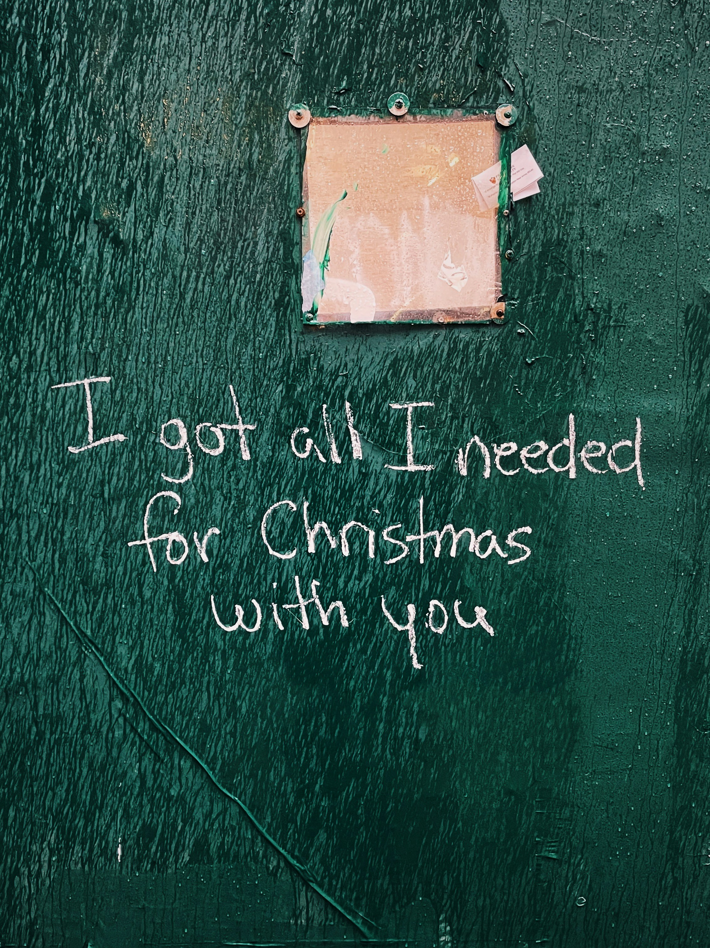 Chalked Christmas on a Weathered Green Door