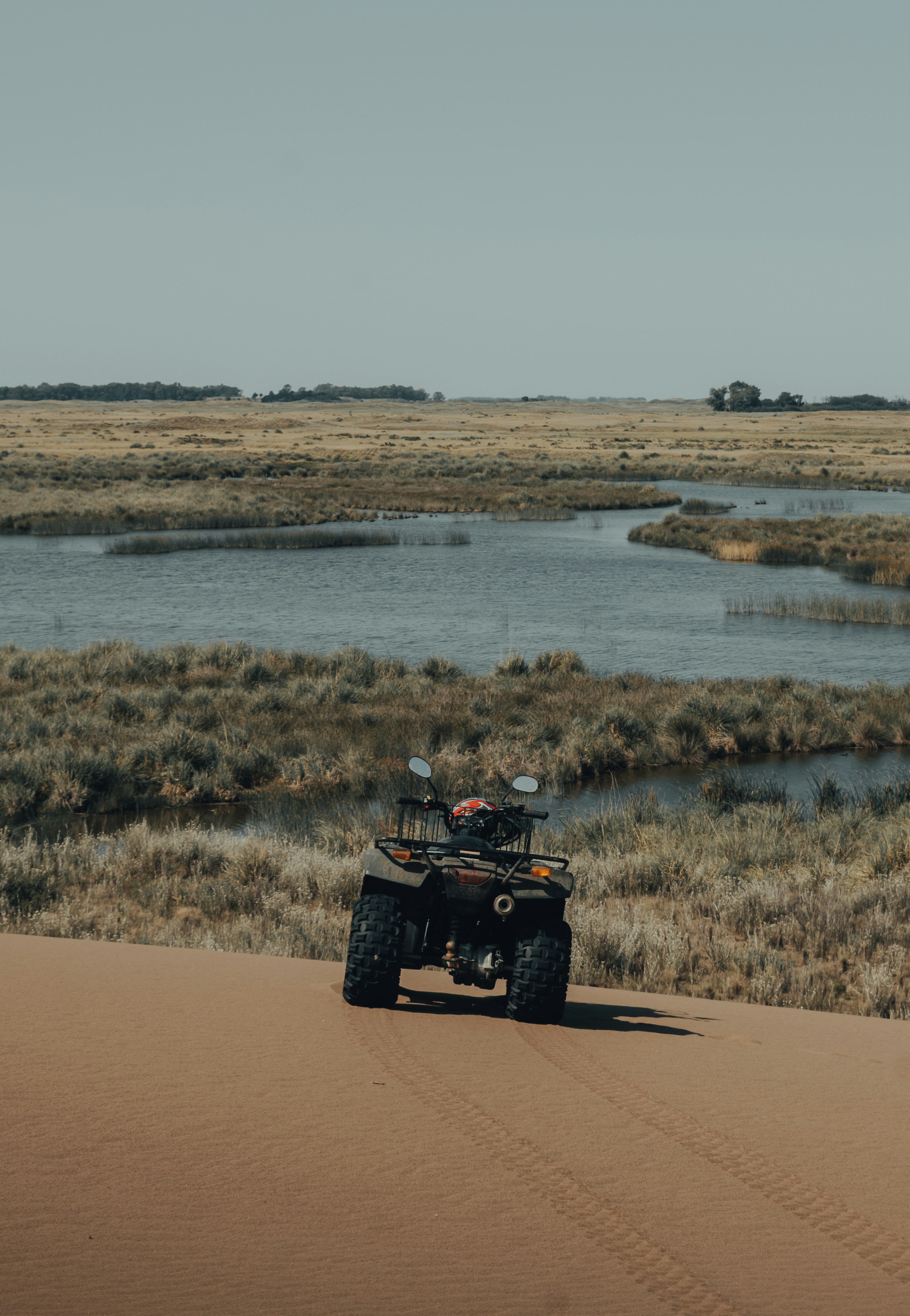 Yellow and black atv on brown field during daytime photo – Free Machine ...