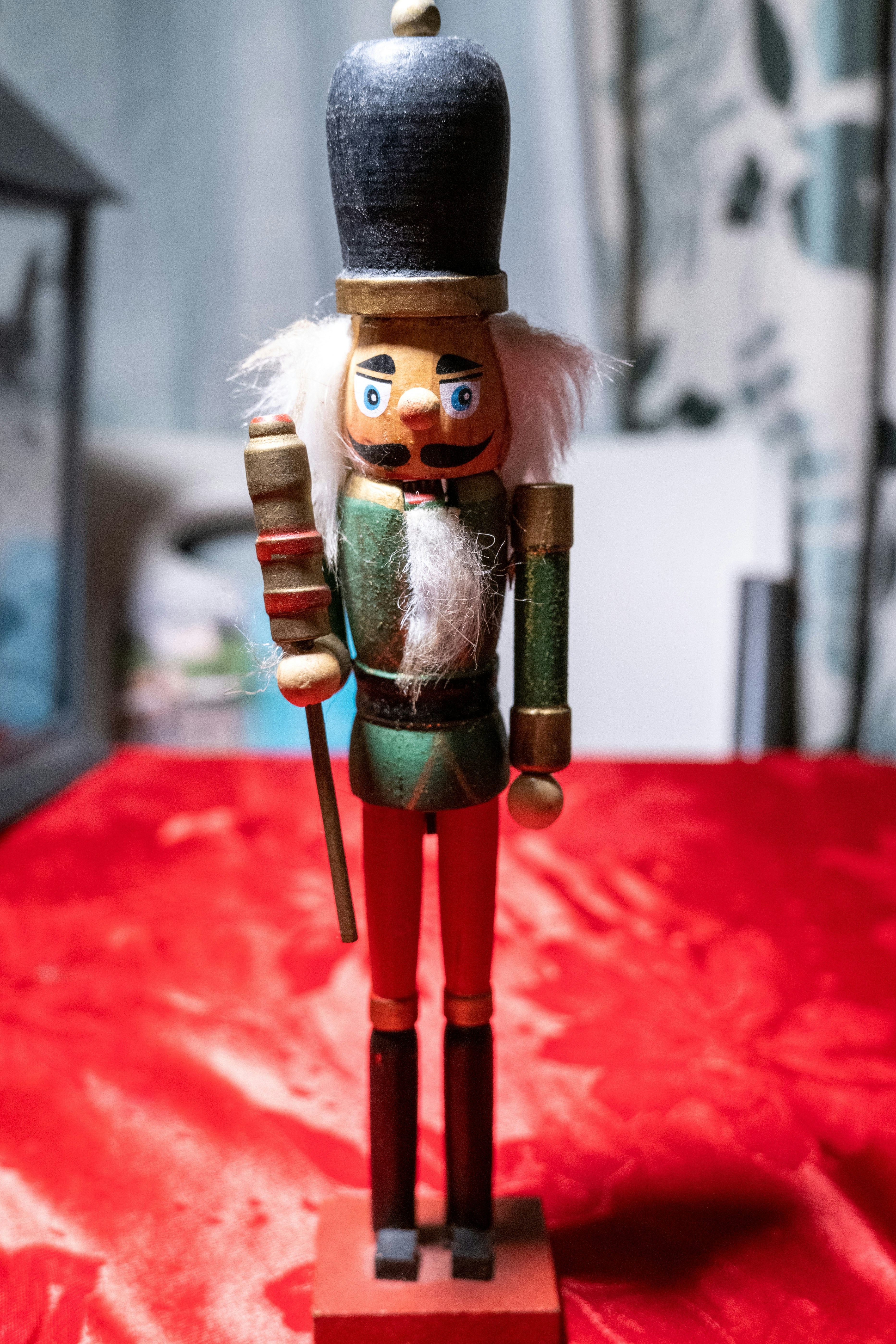 Nutcracker Sentinel: A Tiny Soldier Stood Quietly on Red Velvet