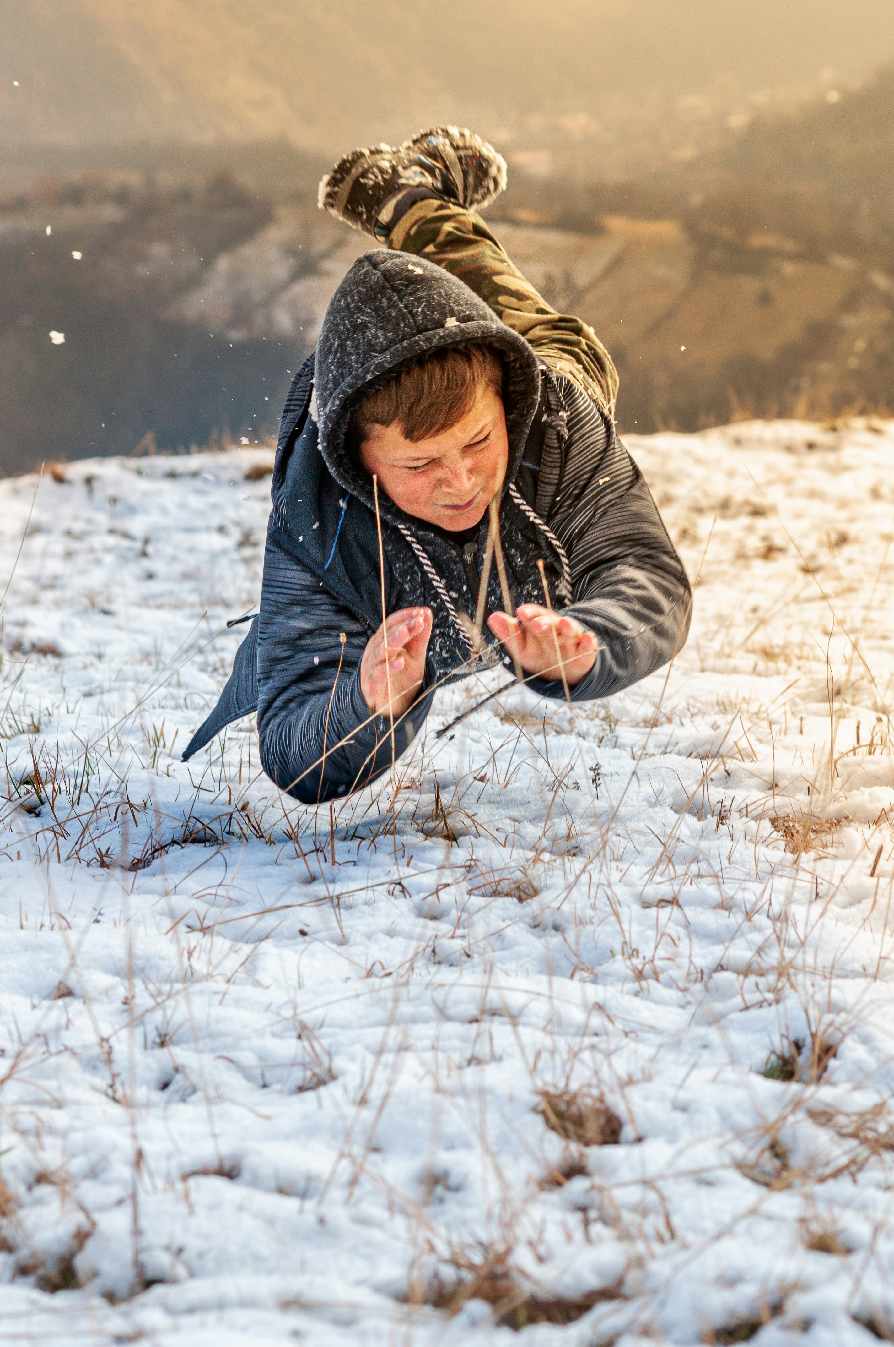 Snowbound Reach: Hands Carving Through Frost on a Sunlit Ridge