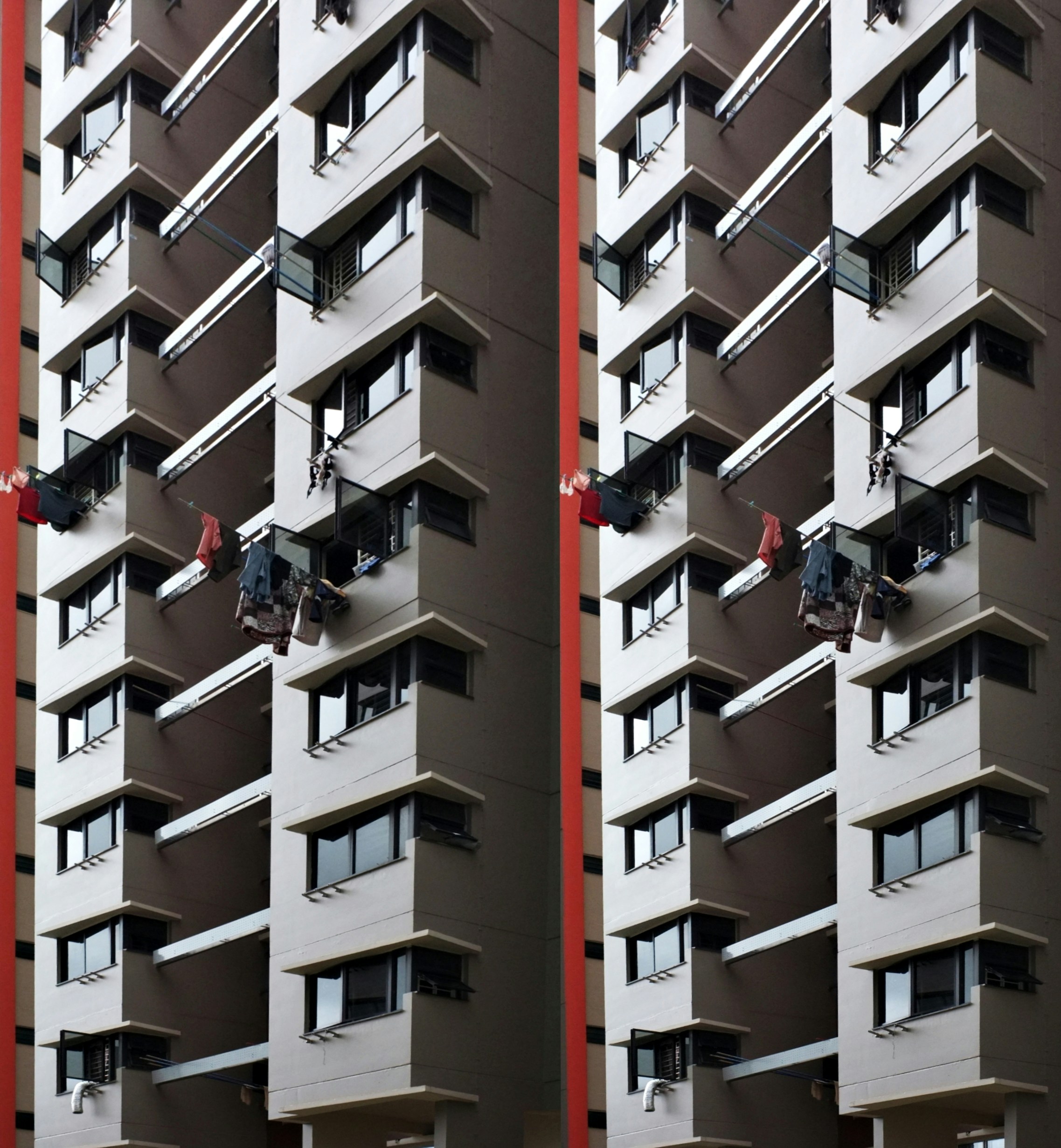 People walking on street in between high rise buildings during daytime ...