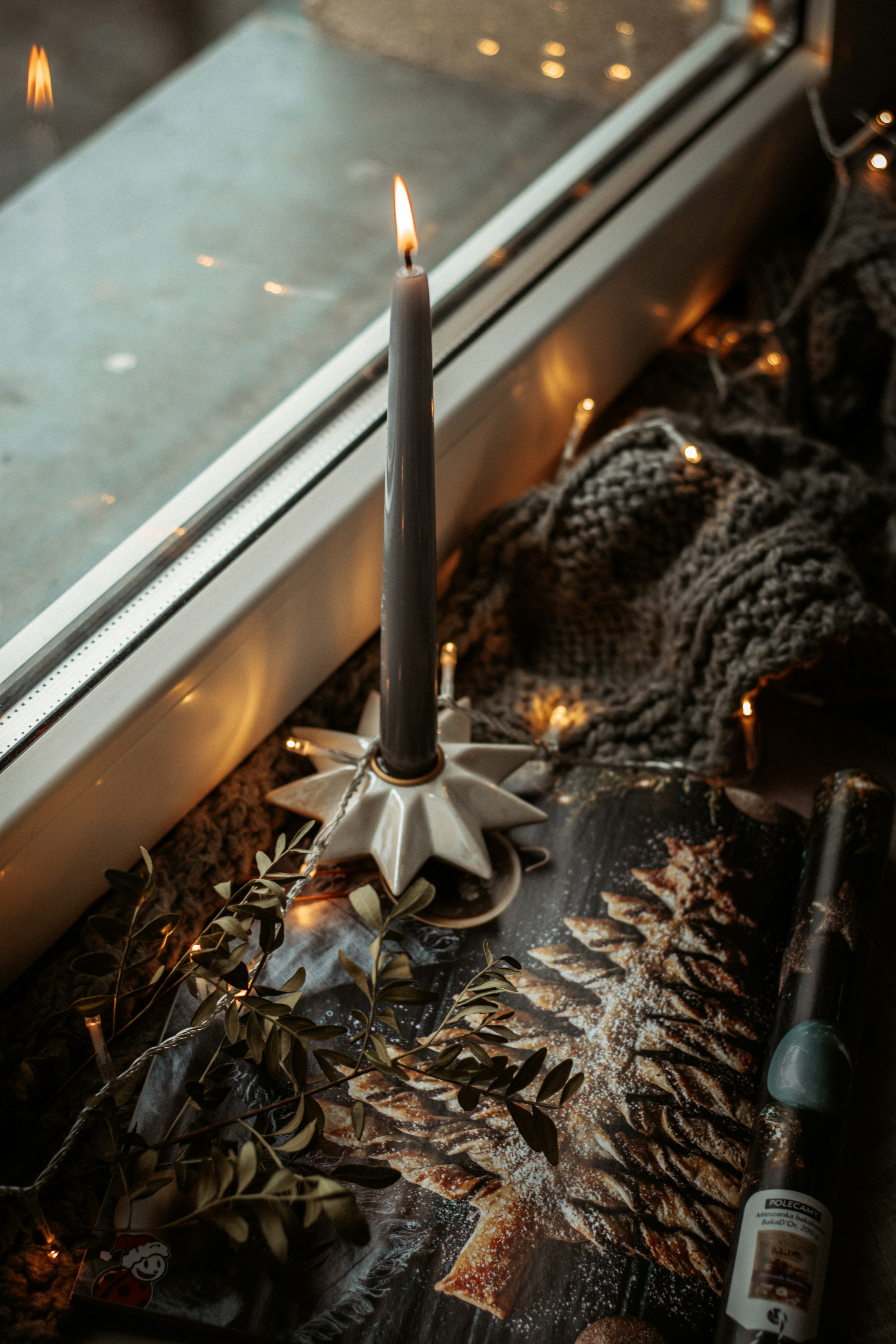 Starlit Candle on a Cozy Windowsill with Fern and Fairy Lights