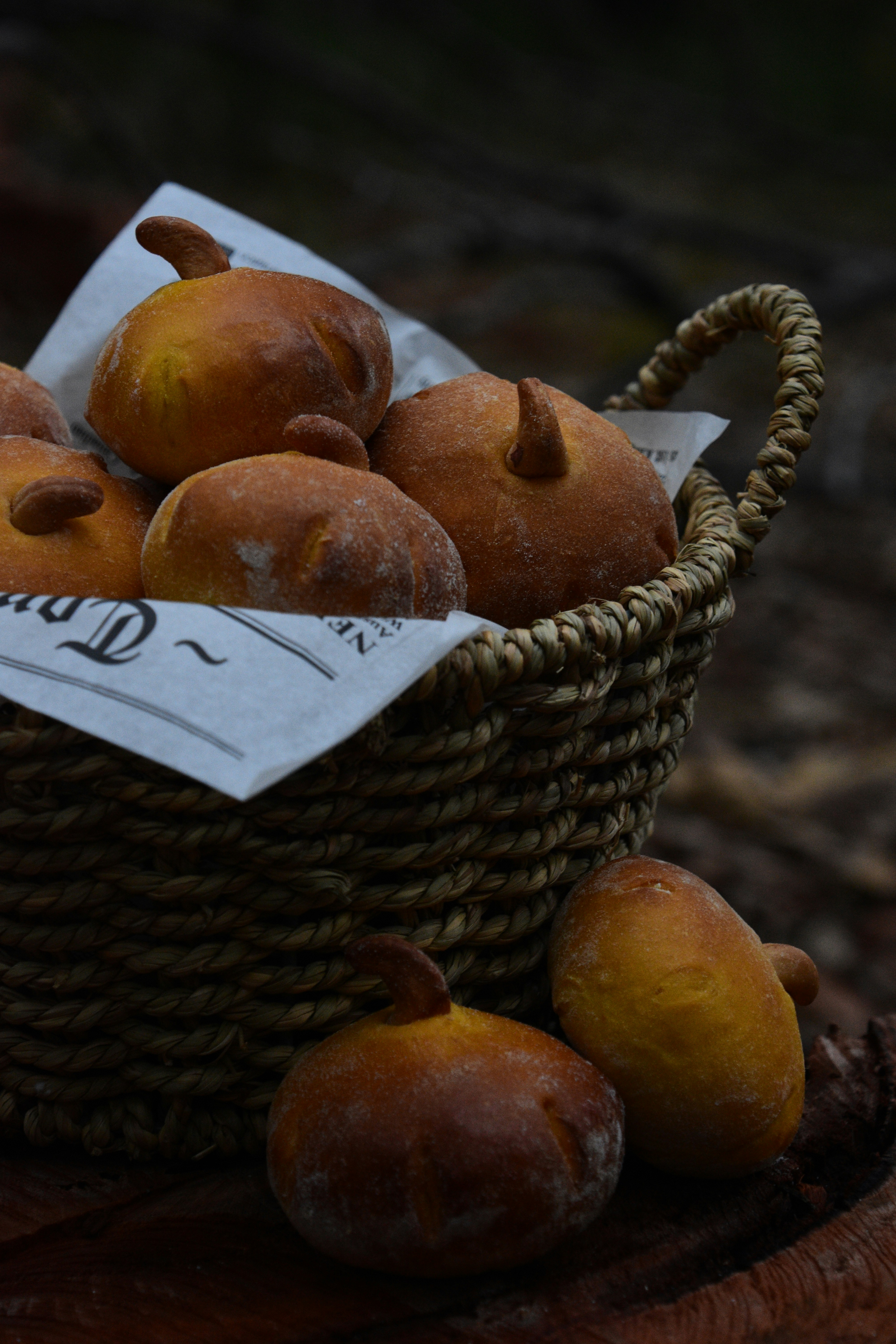 Amber Pears on a Newsprint Stage in a Woven Basket