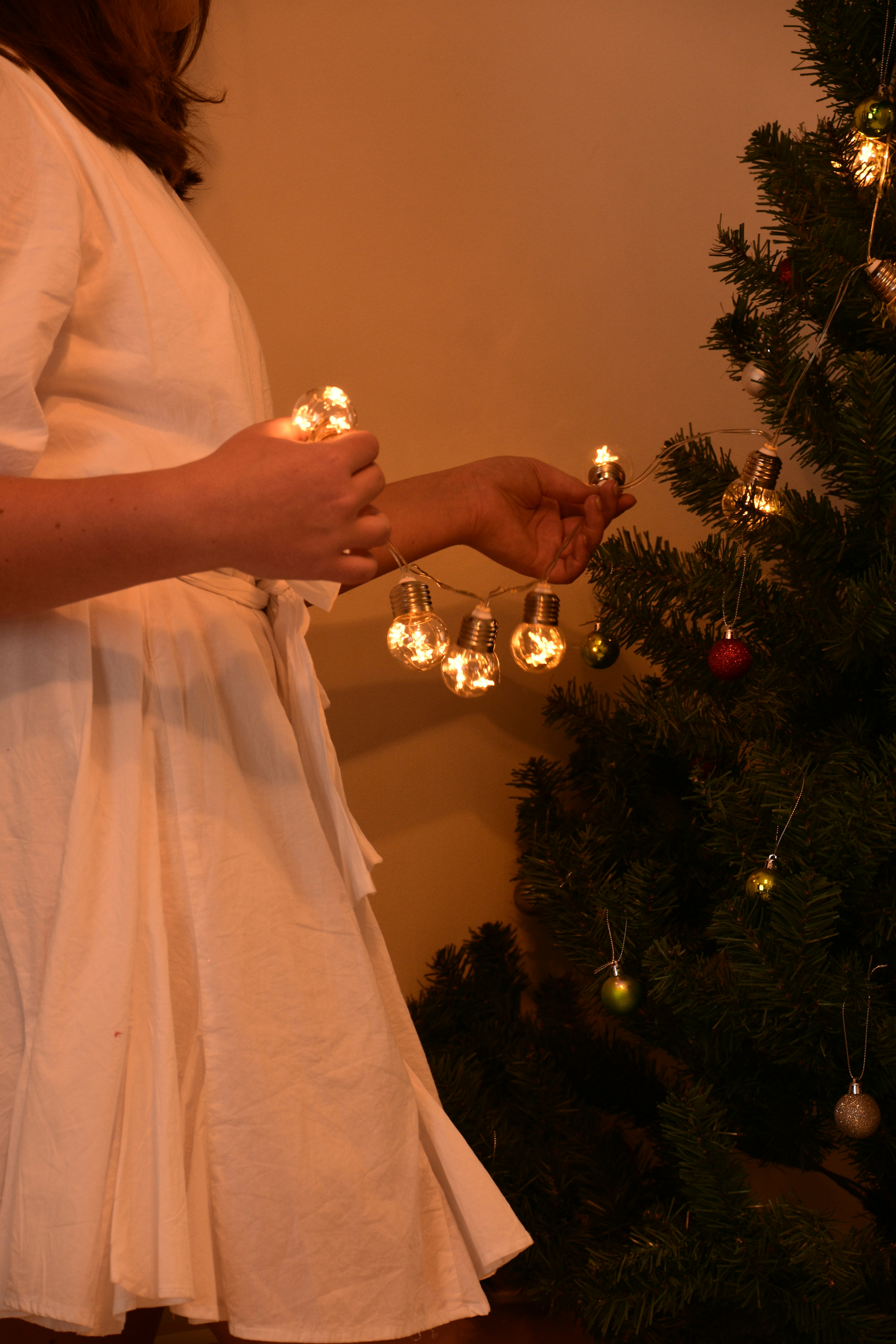 Cozy Christmas Moments: String Lights Placed By Hand