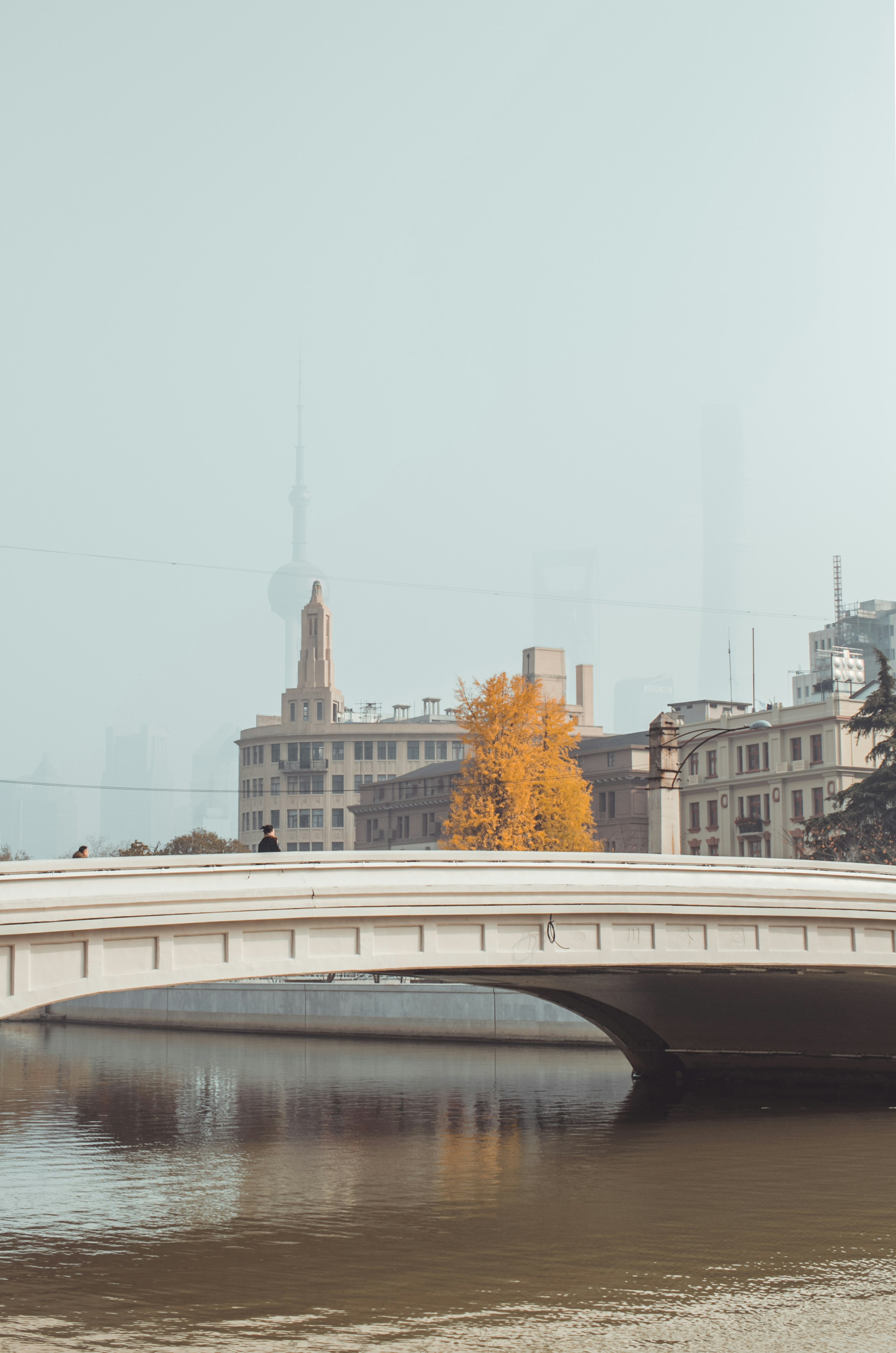White concrete building near bridge during daytime photo – Free Brown ...