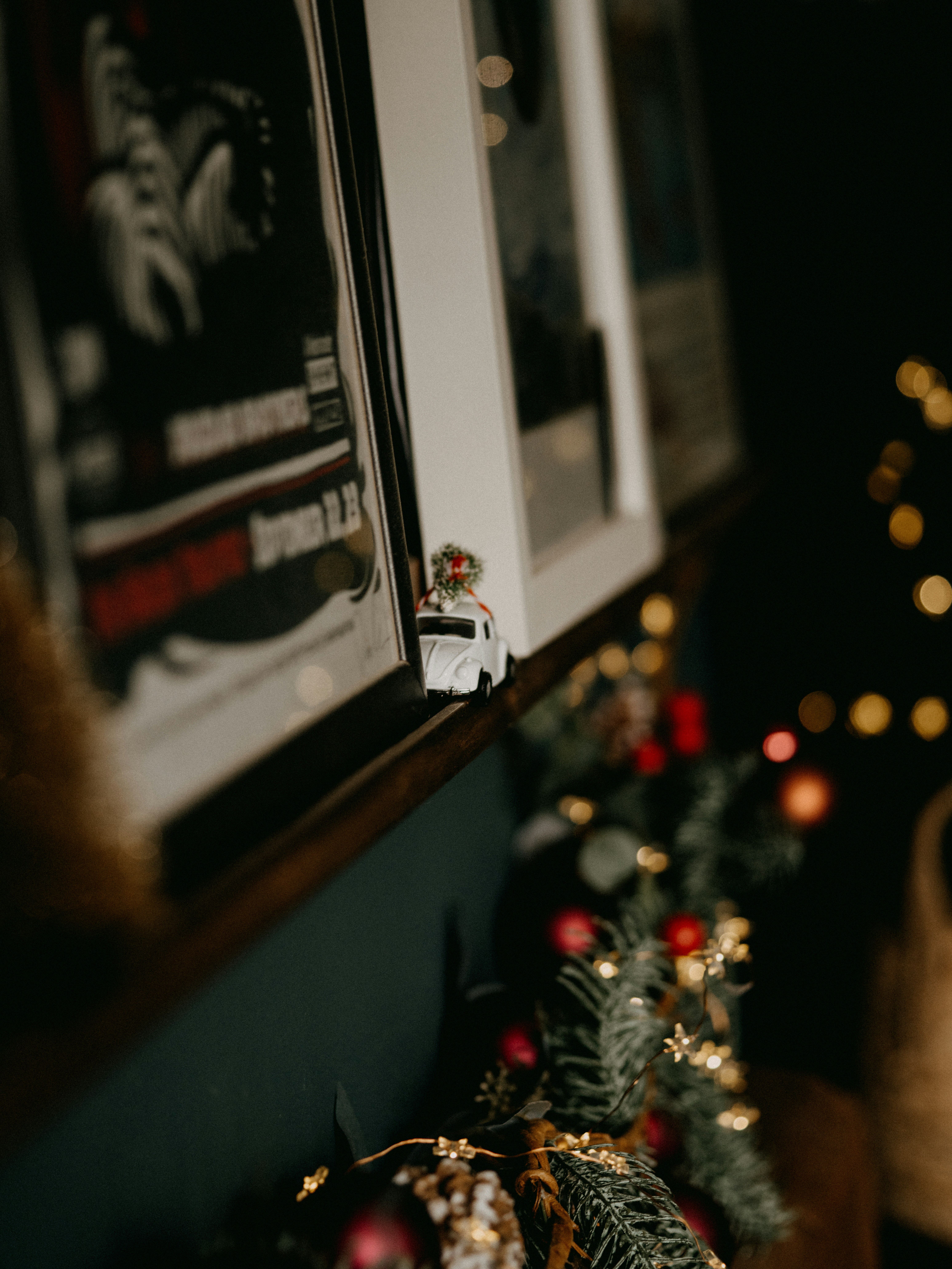 Tiny Santa-Car Perched on a Windowsill Beneath a Warm Christmas Glow