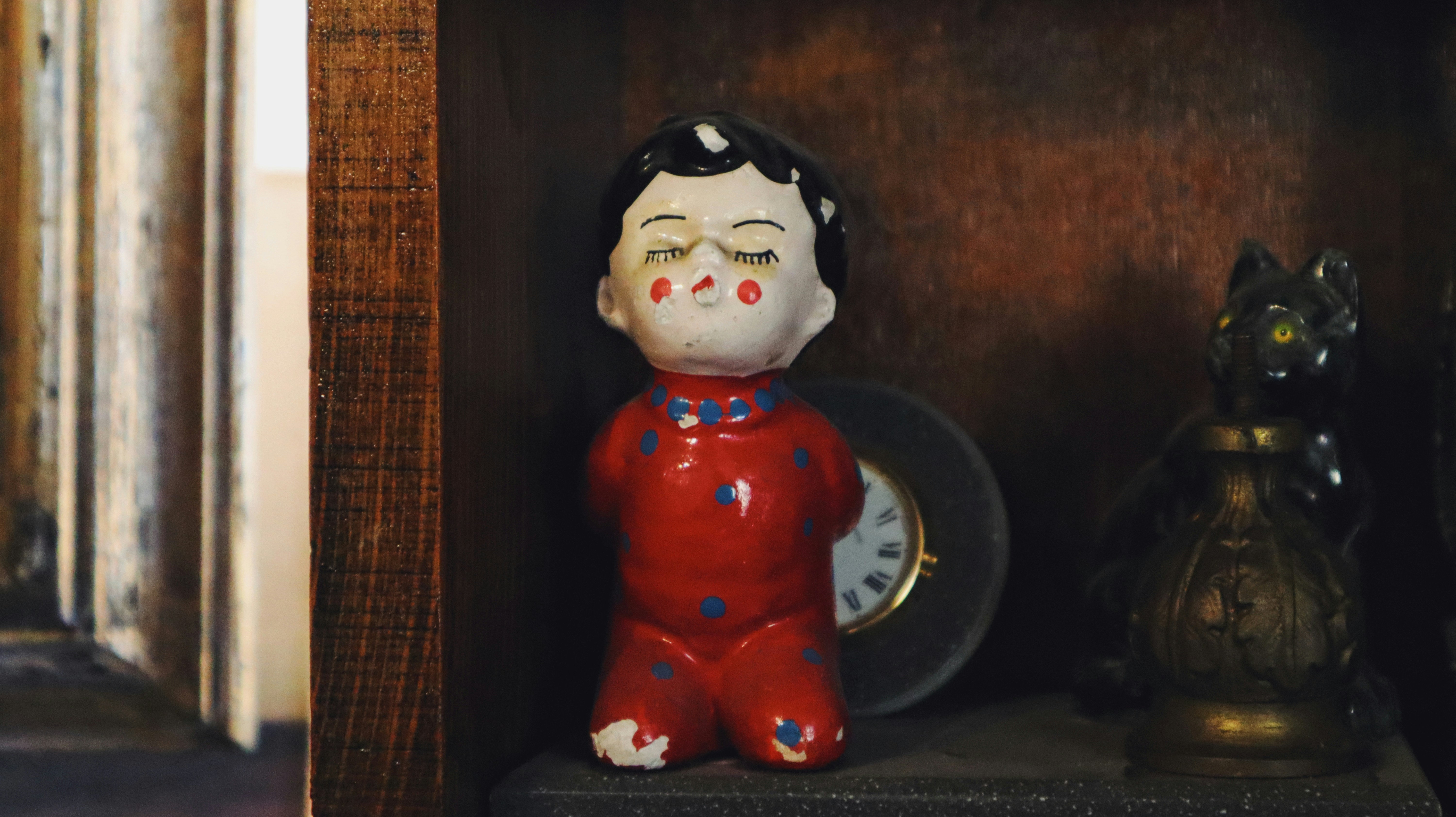 Miniature Red-Jersey Figurine Guarding a Clock