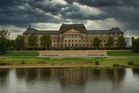 Riverside Neoclassical Facade Under a Tempest