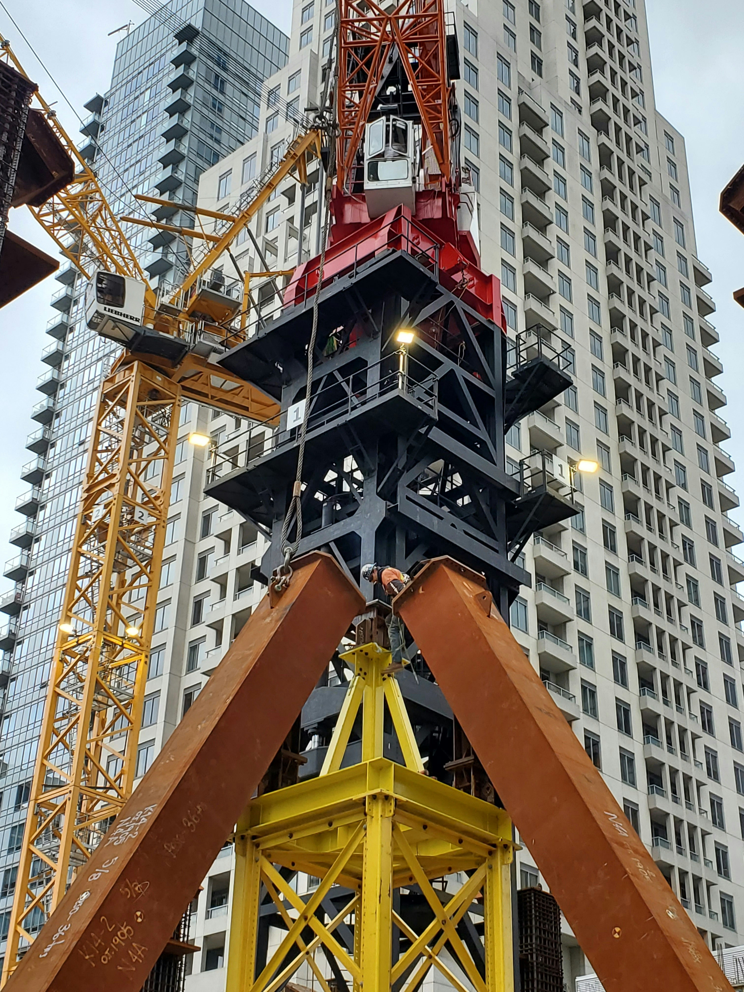 yellow and red metal crane