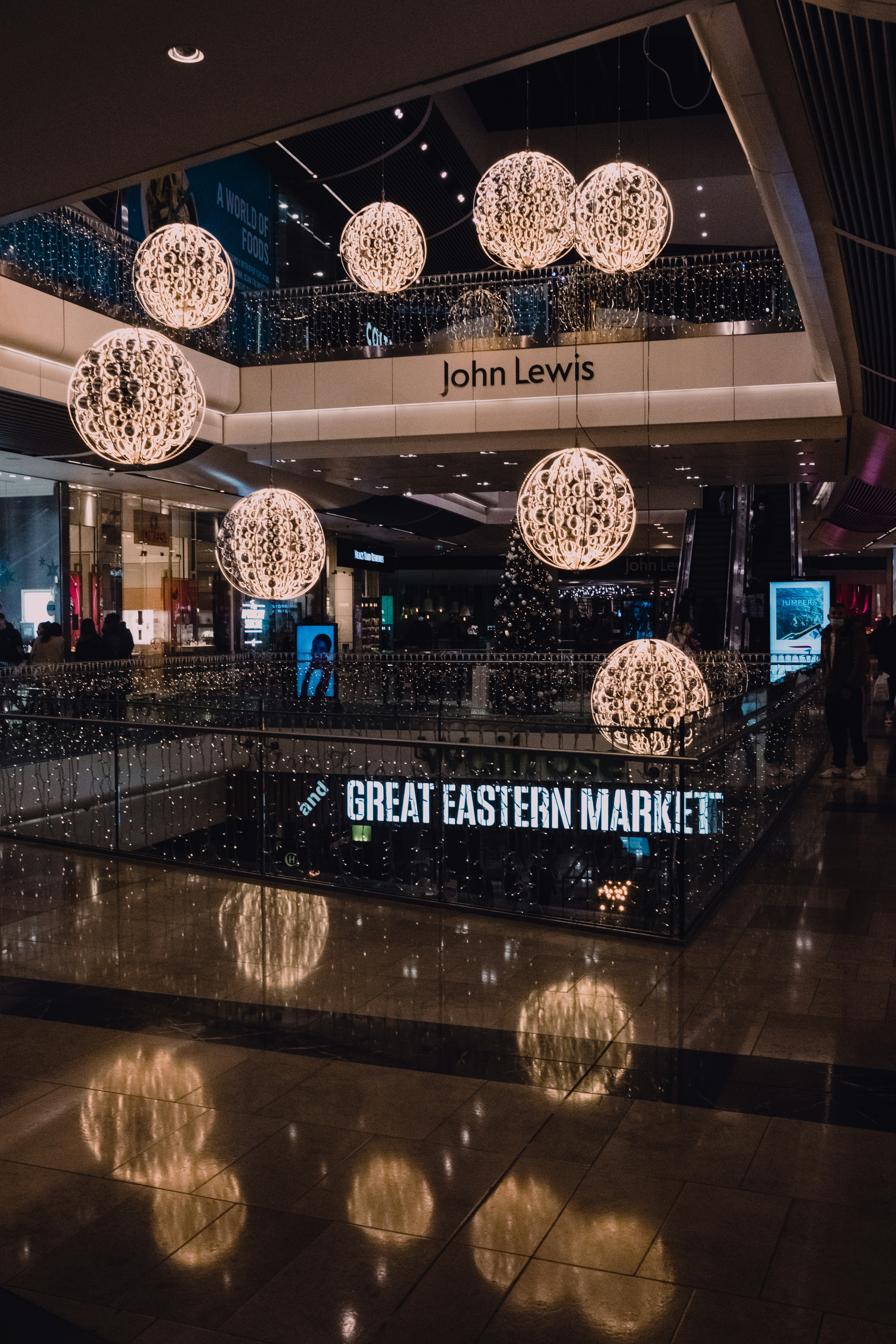 Luminous Spheres Over a Shimmering Atrium