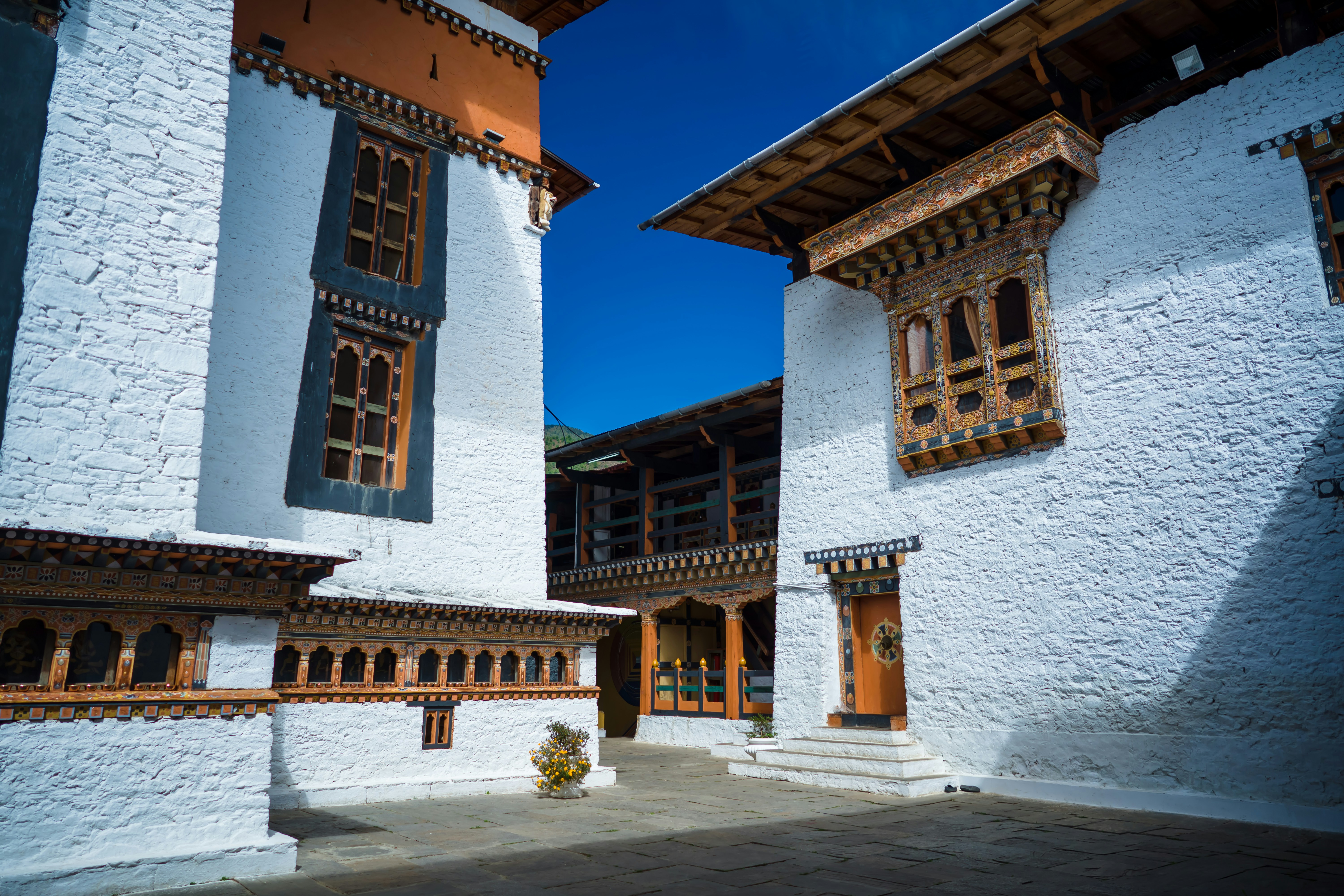 Brown and white concrete building during daytime photo – Free Bhutan ...