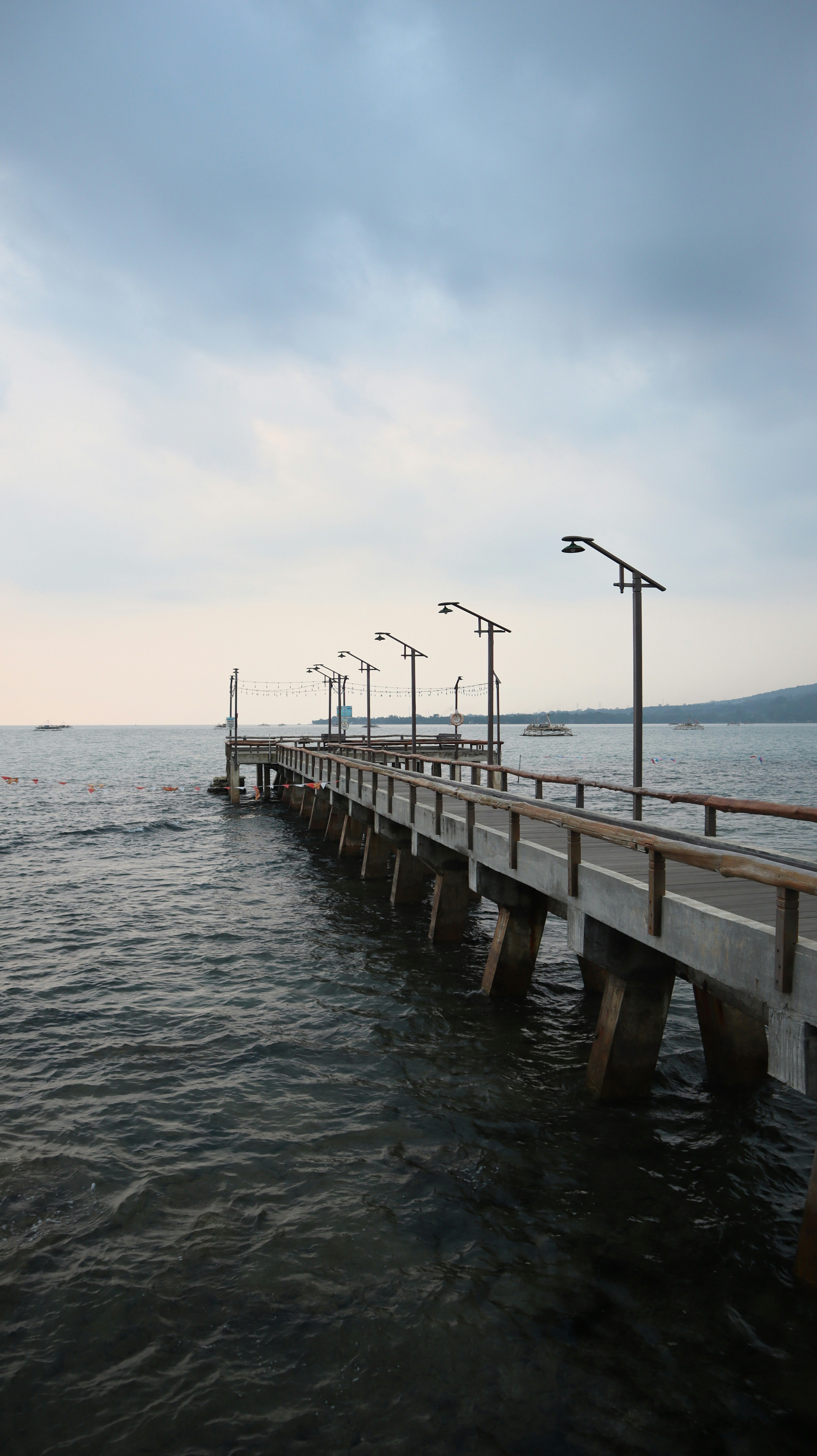 Brown wooden dock on sea under white sky during daytime photo – Free ...